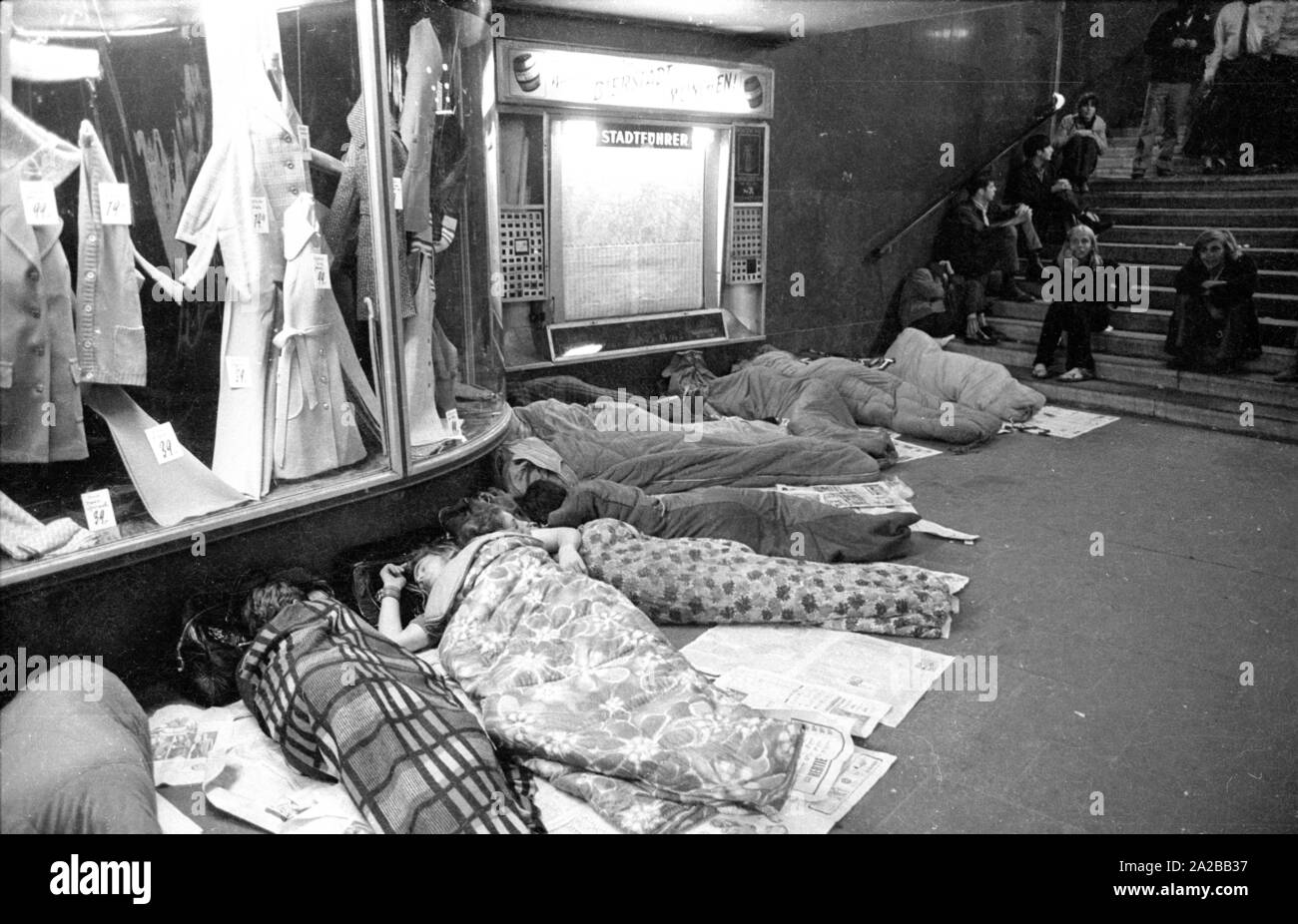 Homeless people sleeping in the mezzanine floor at the Munich Main ...