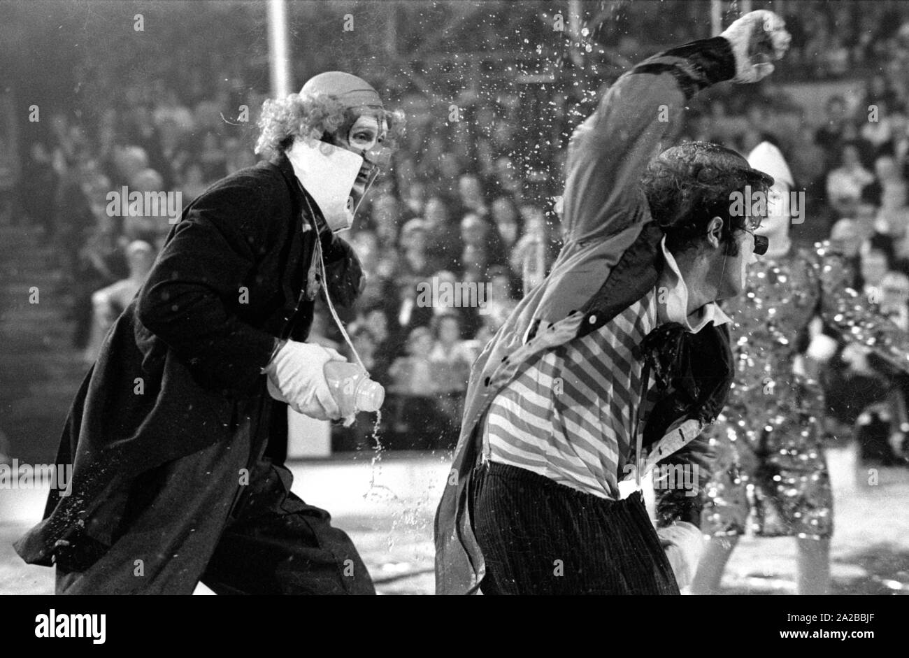 Clowns perform a classic clown act with a funnel in the TV show "Stars ...