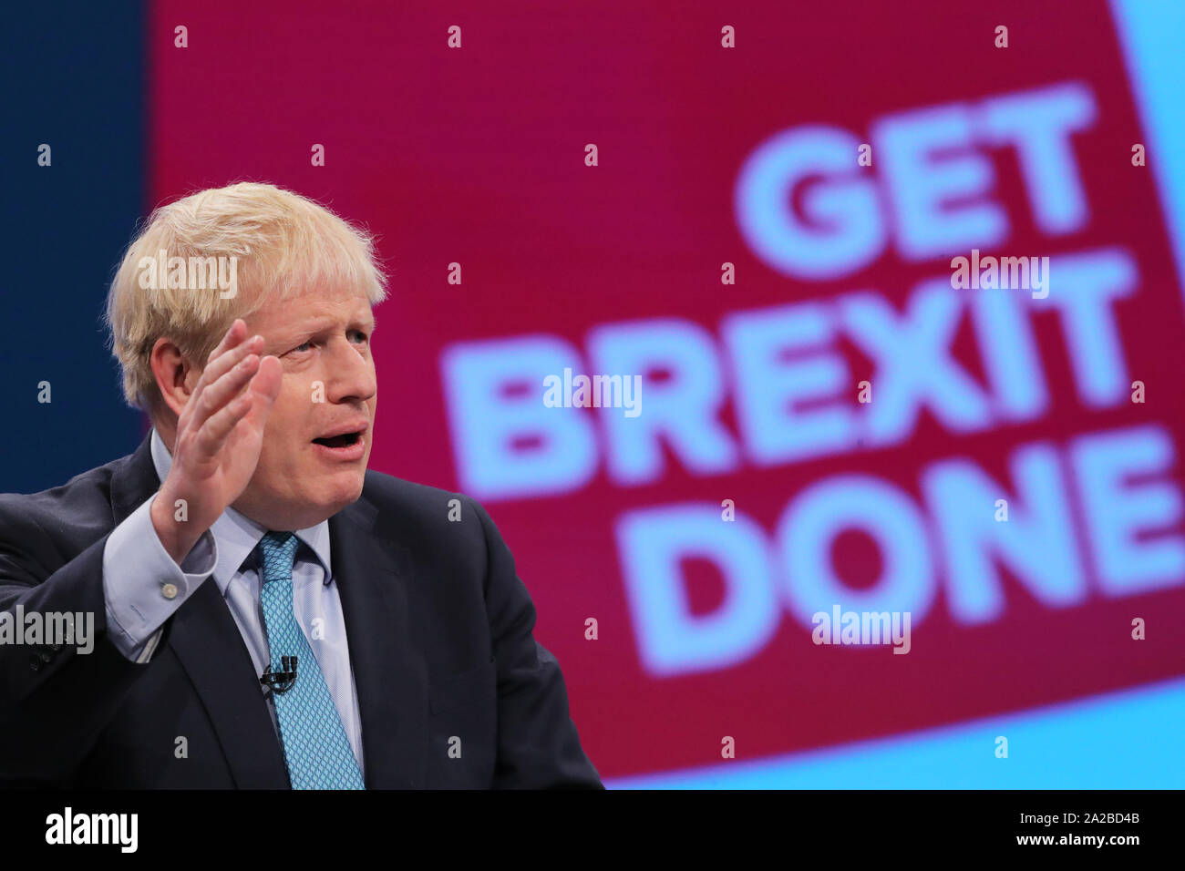 Prime Minister Boris Johnson on stage giving his speech at the ...