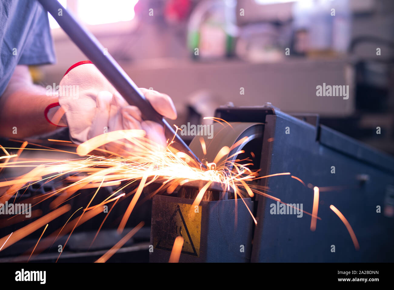 Grinding steel with lot of sparks Stock Photo - Alamy