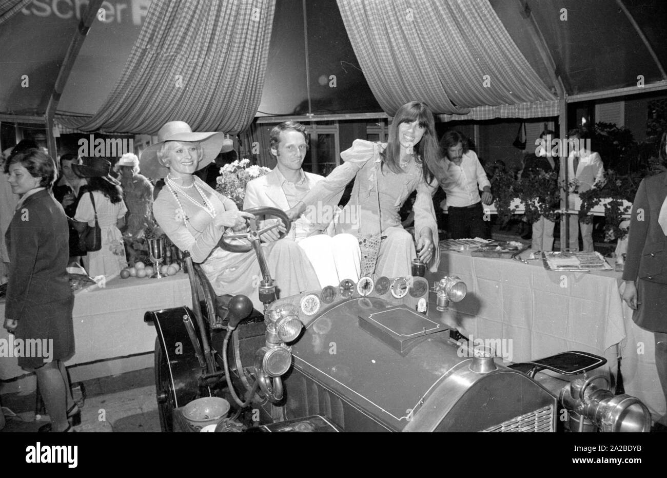 The Austrian racing driver Niki Lauda celebrates in the trendy "Why Not ...