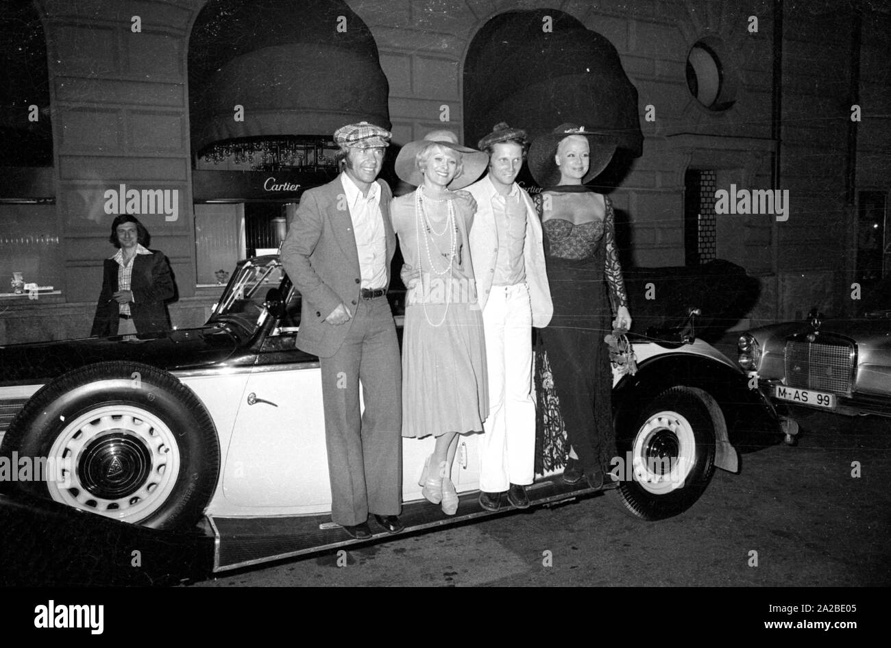 The Austrian racing driver Niki Lauda (2nd from left) celebrates in the ...