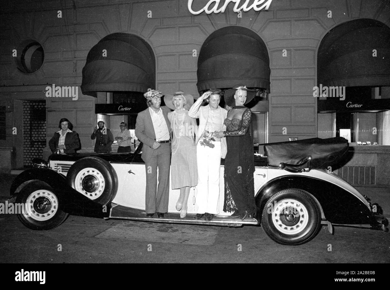 The Austrian racing driver Niki Lauda (2nd from left) celebrates in the ...