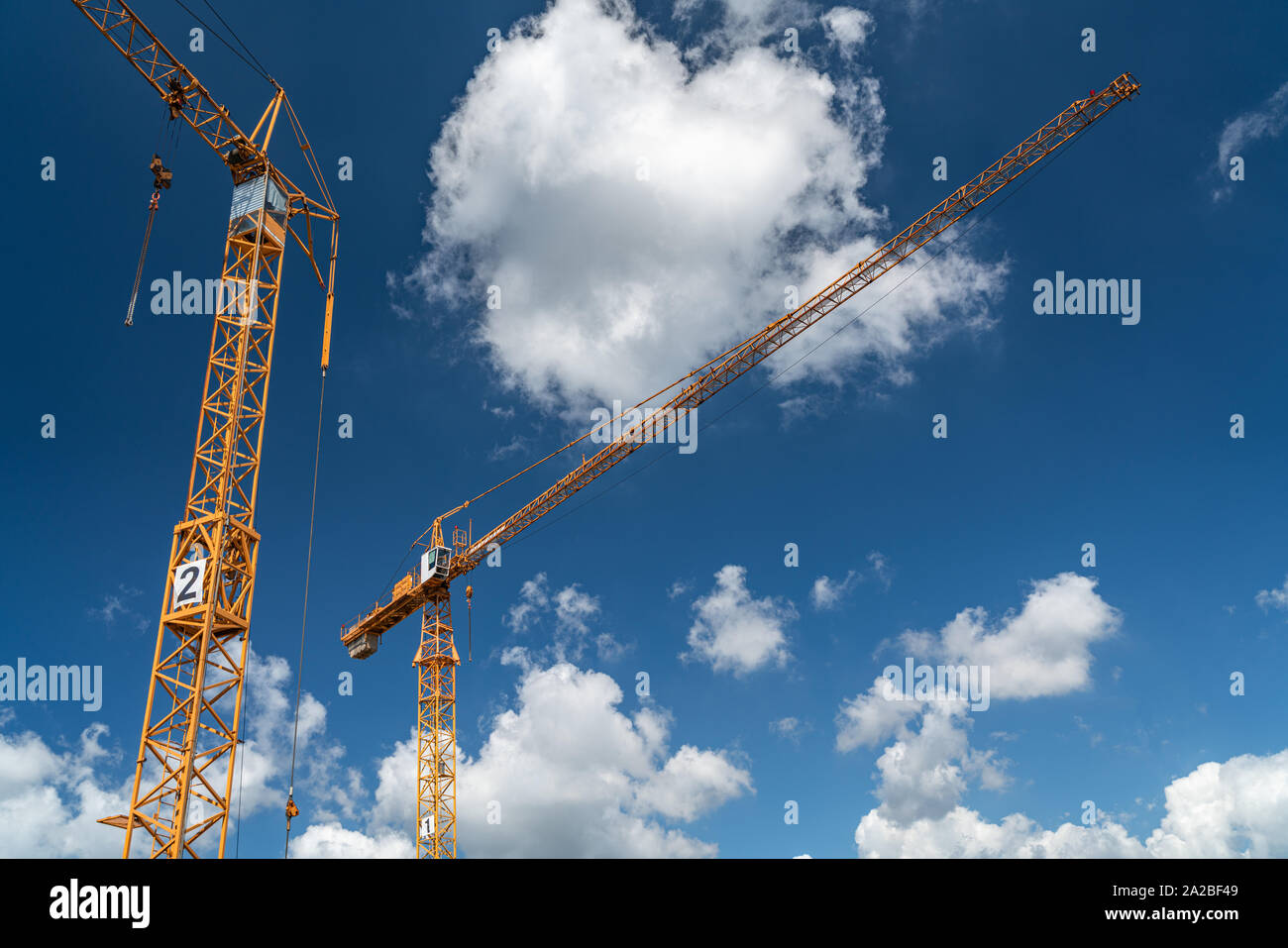Cranes during work during loading Stock Photo - Alamy