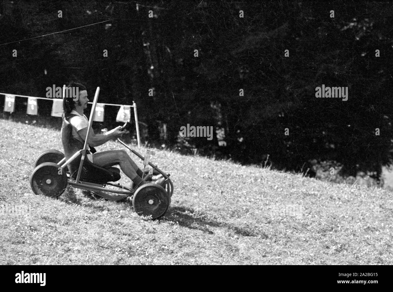 Young people ride "downhill carts", here called "sloper". Here, the ...