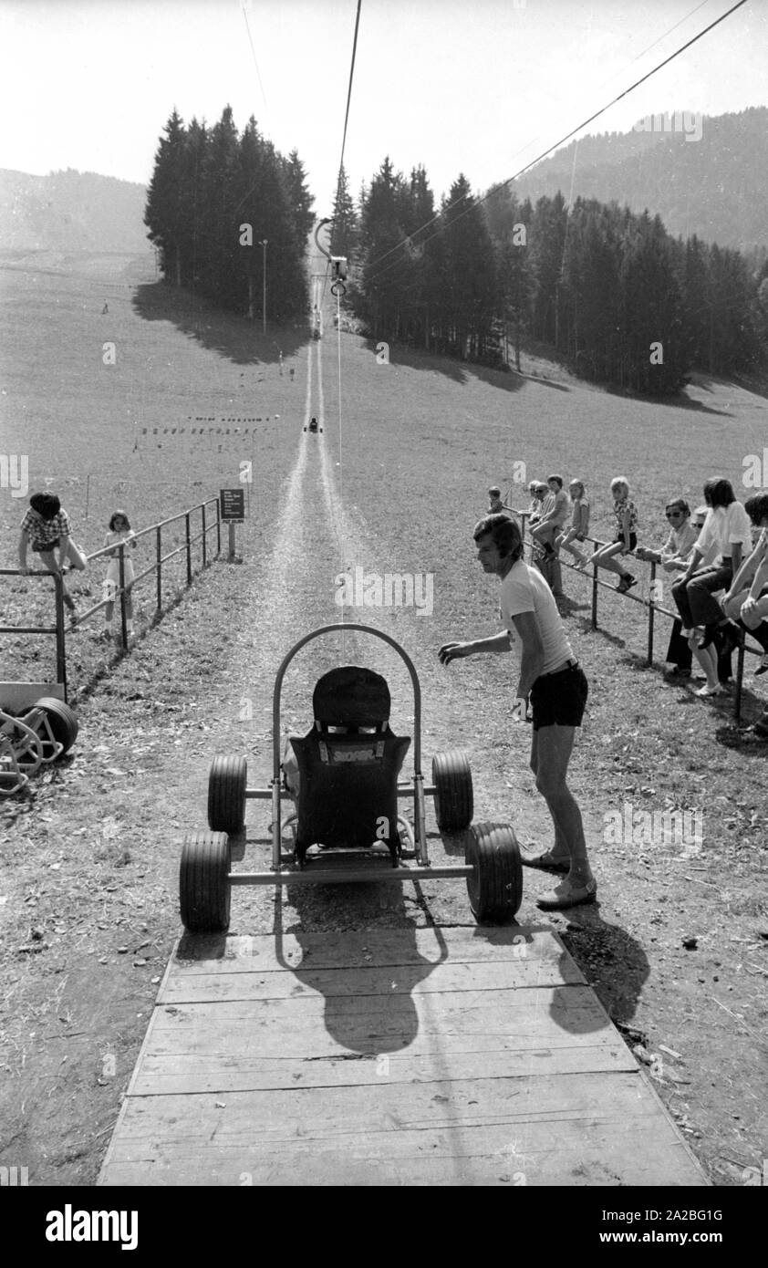 Young people ride "downhill carts", here called "sloper". Here, the ...