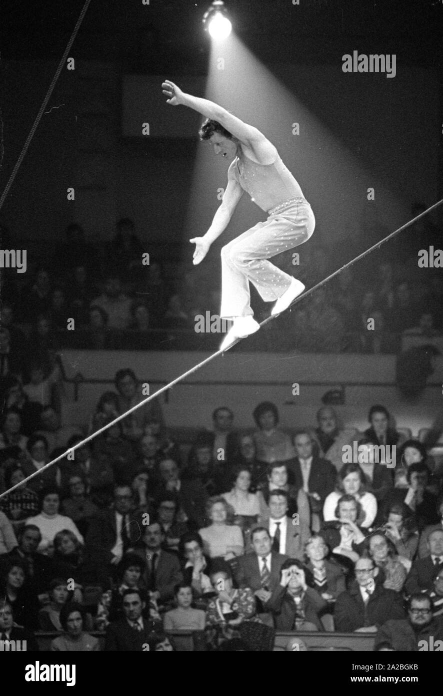 Performance of a tightrope artist in a circus, probably the Circus ...
