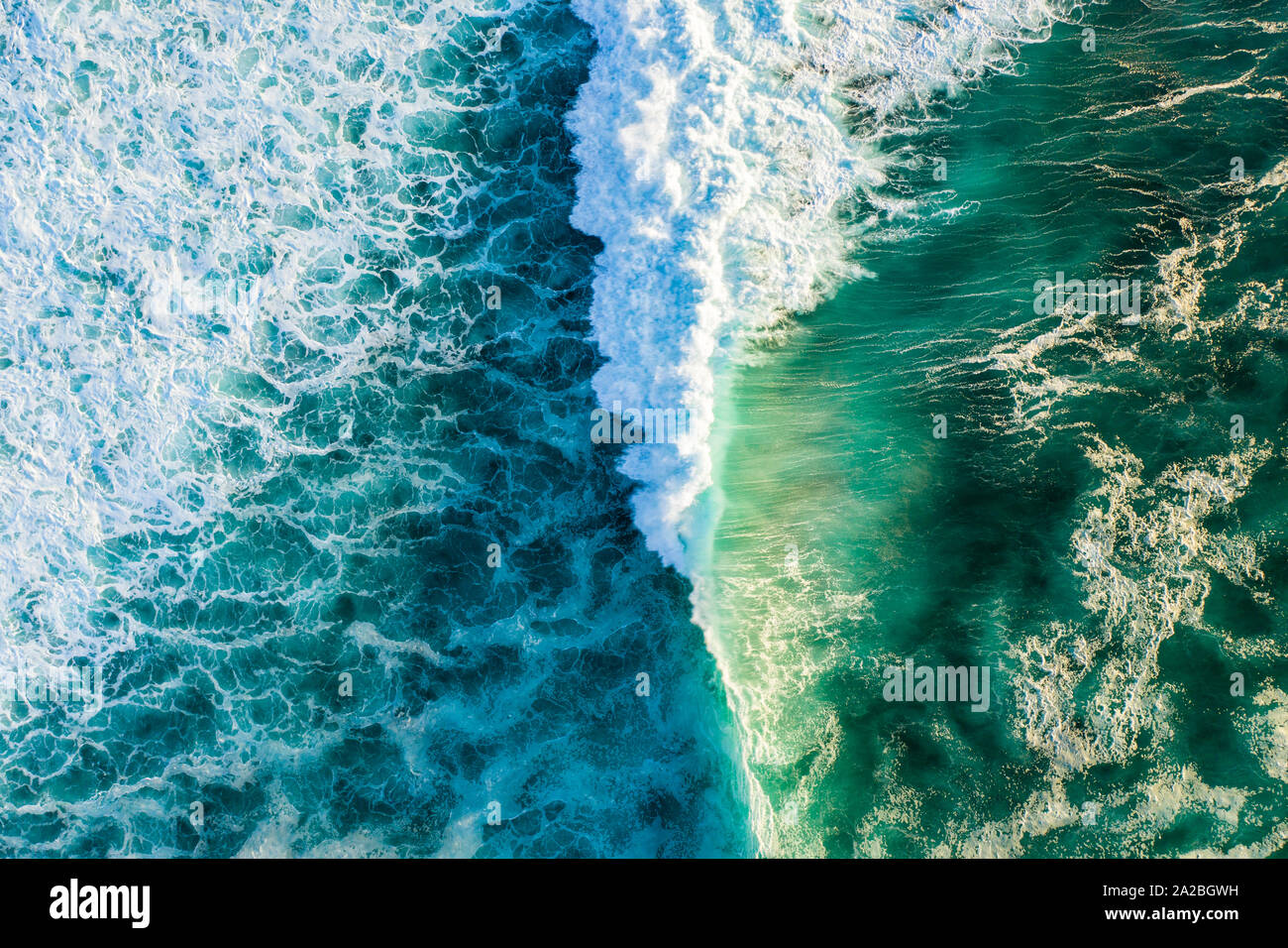Aerial looking straight down onto large swell and waves in Bali Stock ...