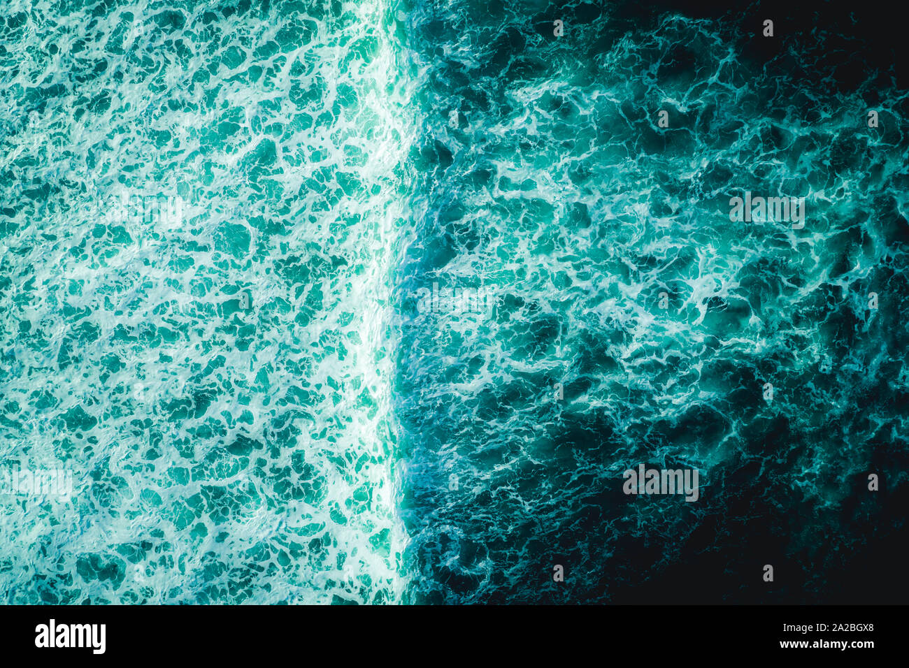 Large wave through the ocean creating a pattern in the surf Stock Photo ...