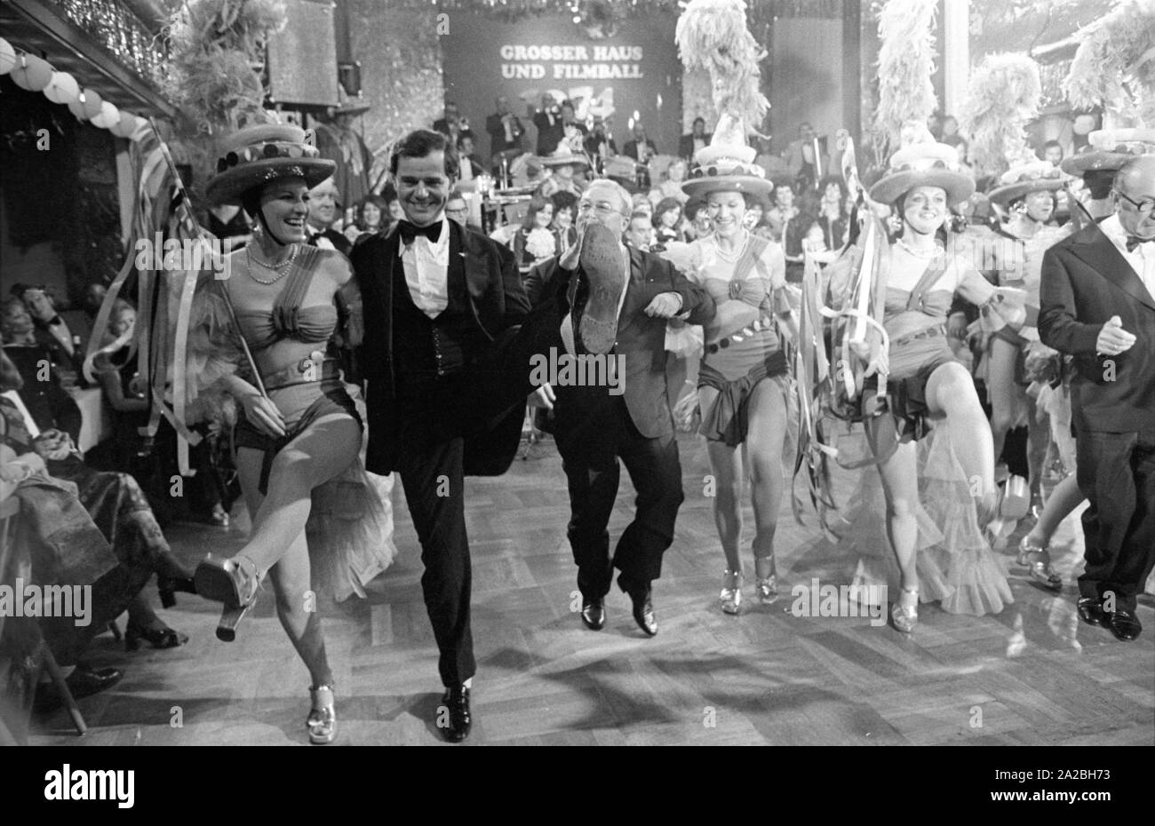 Actor Walter Giller (2nd from left) dances at the German Film Ball 1974 ...