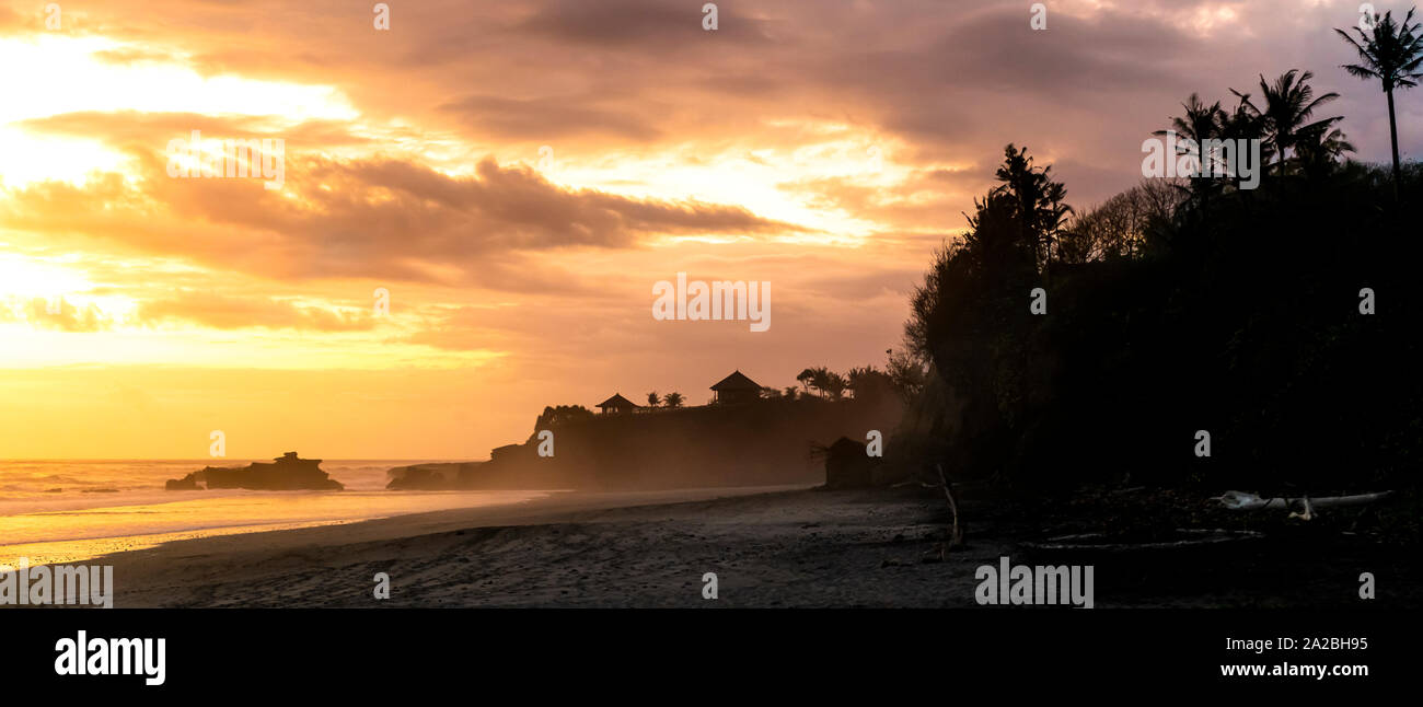 Black sand beach covered in mist and spray at sunset Stock Photo - Alamy