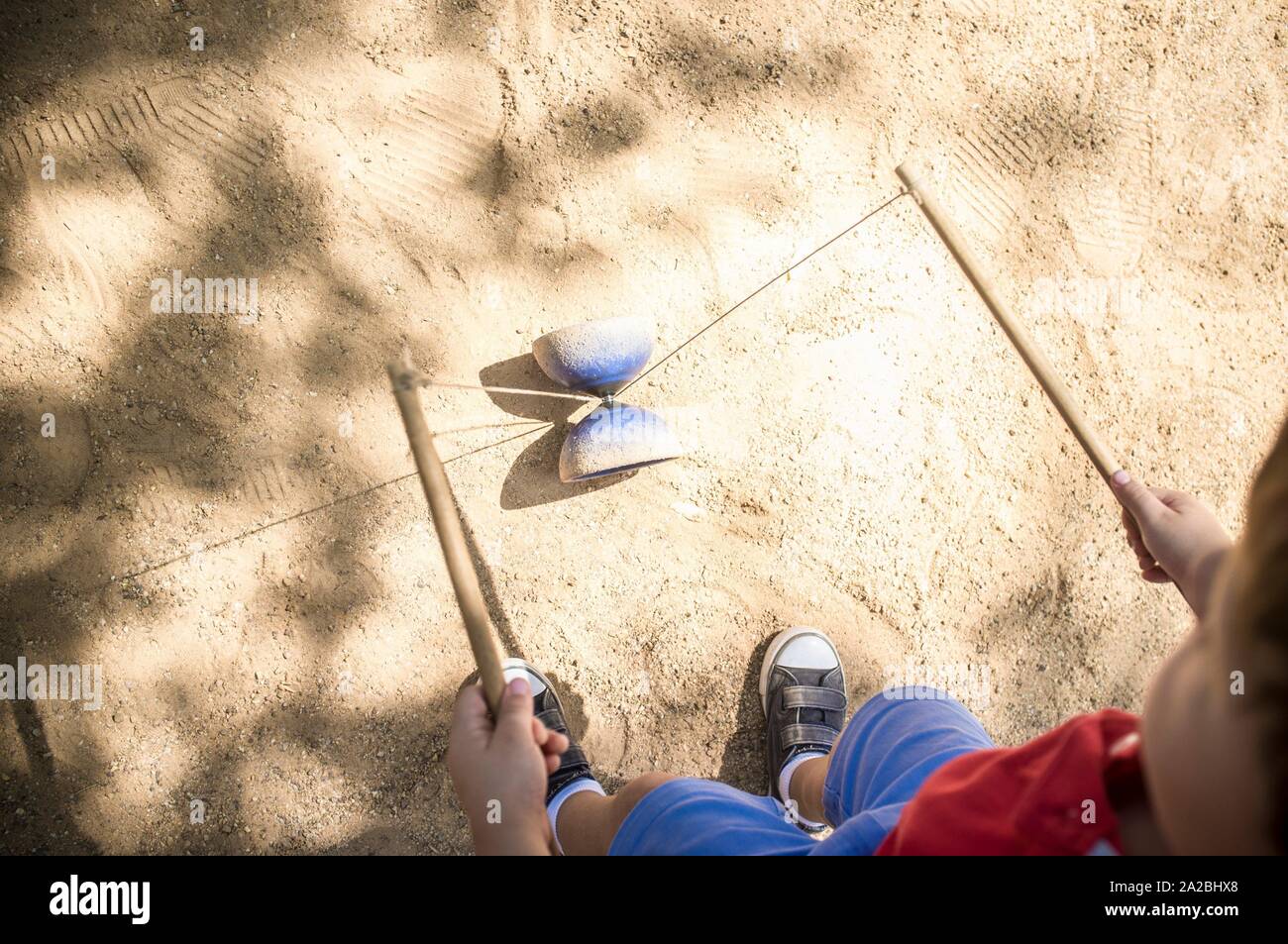 Boy child stick baton hi-res stock photography and images - Alamy