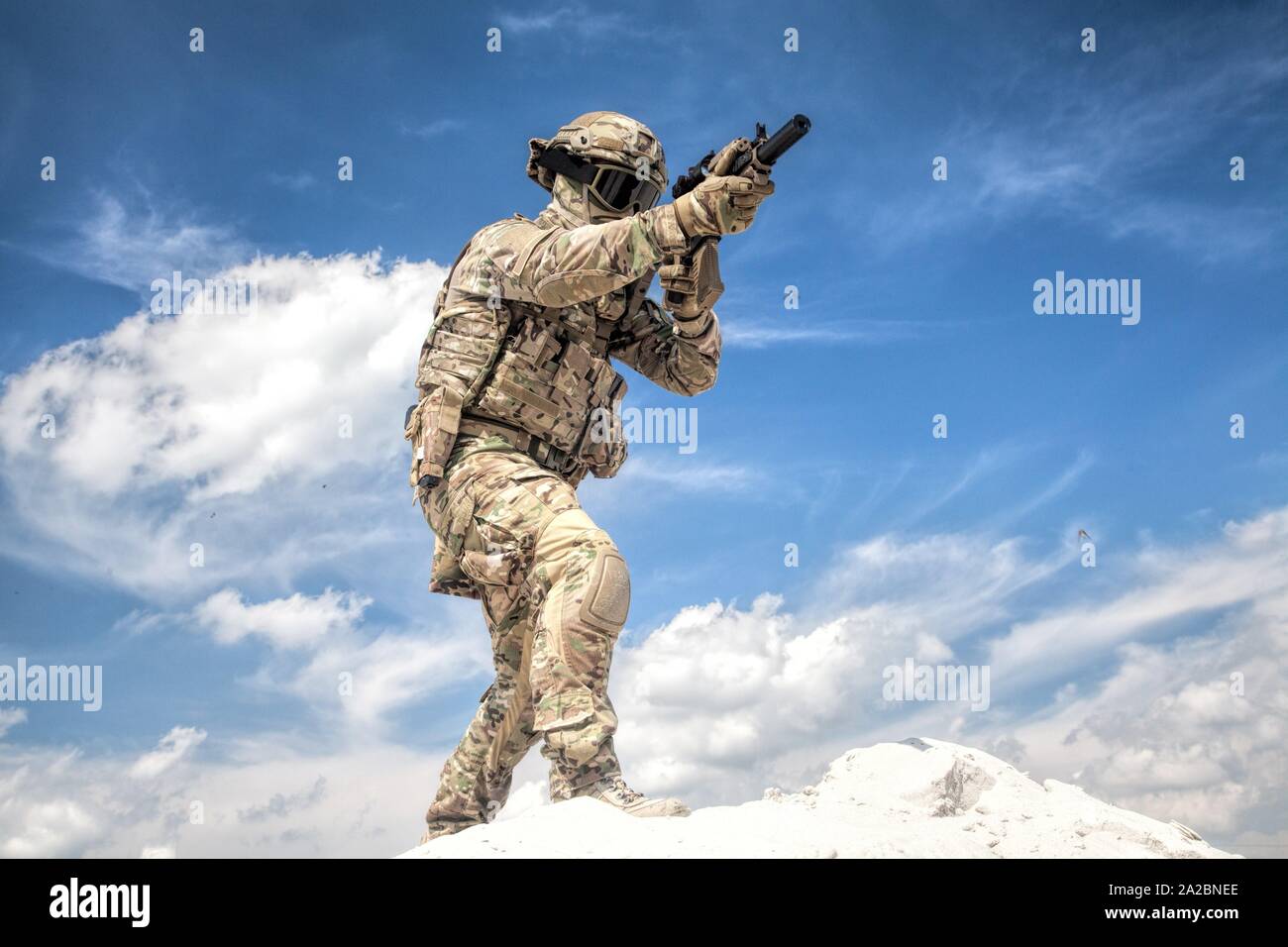 Military with gun in sand hi-res stock photography and images - Alamy