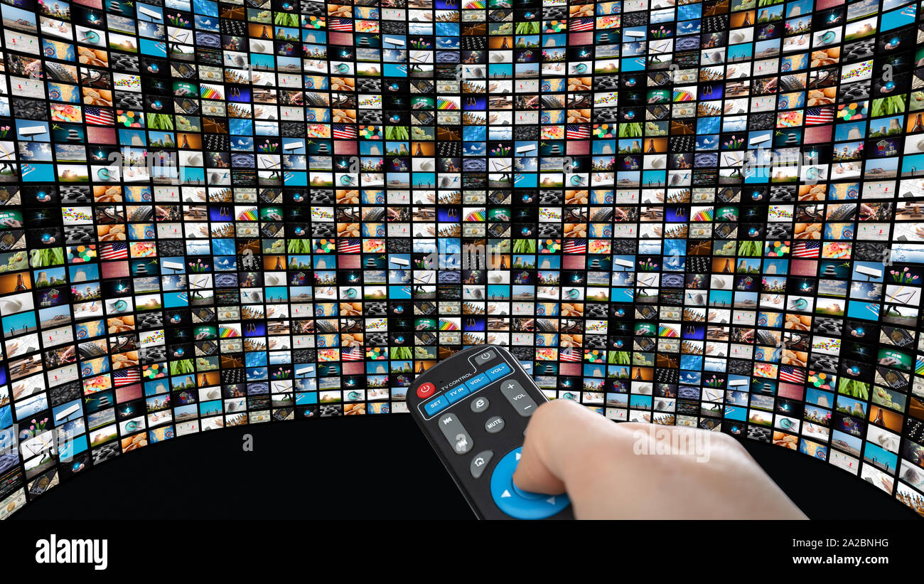 Big interactive TV with many smart channels, man's hand with remote ...