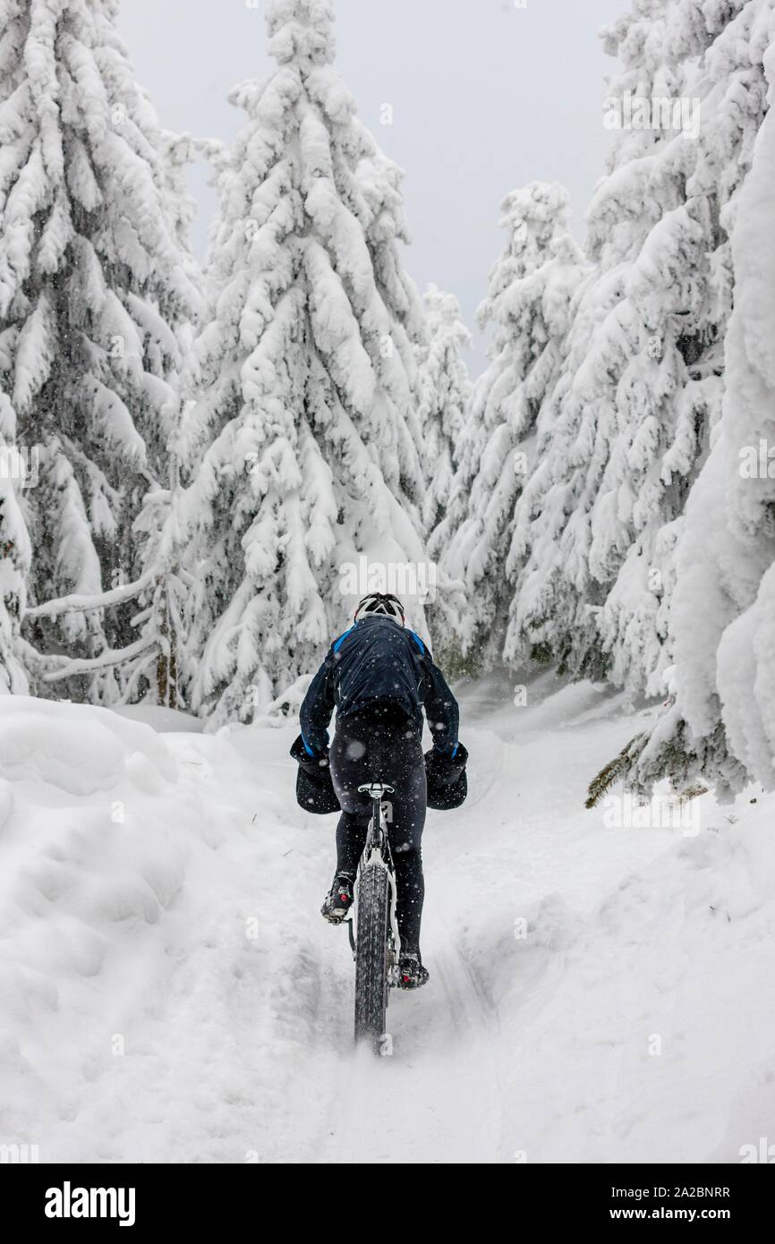 Biking through snow hi-res stock photography and images - Alamy