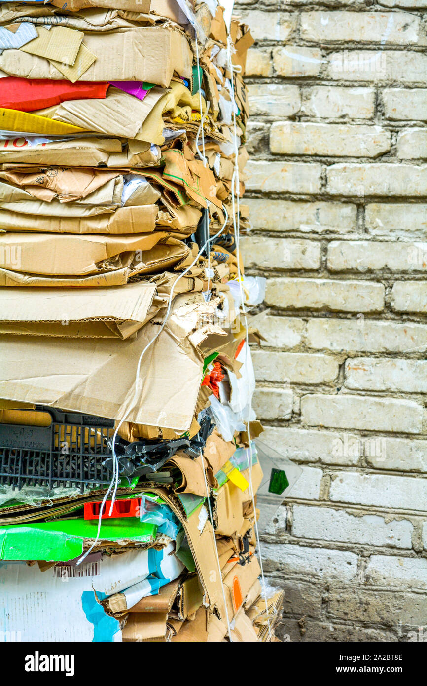 Bundle of wastepaper cardboard to be recycled. Paper cardboard is ...