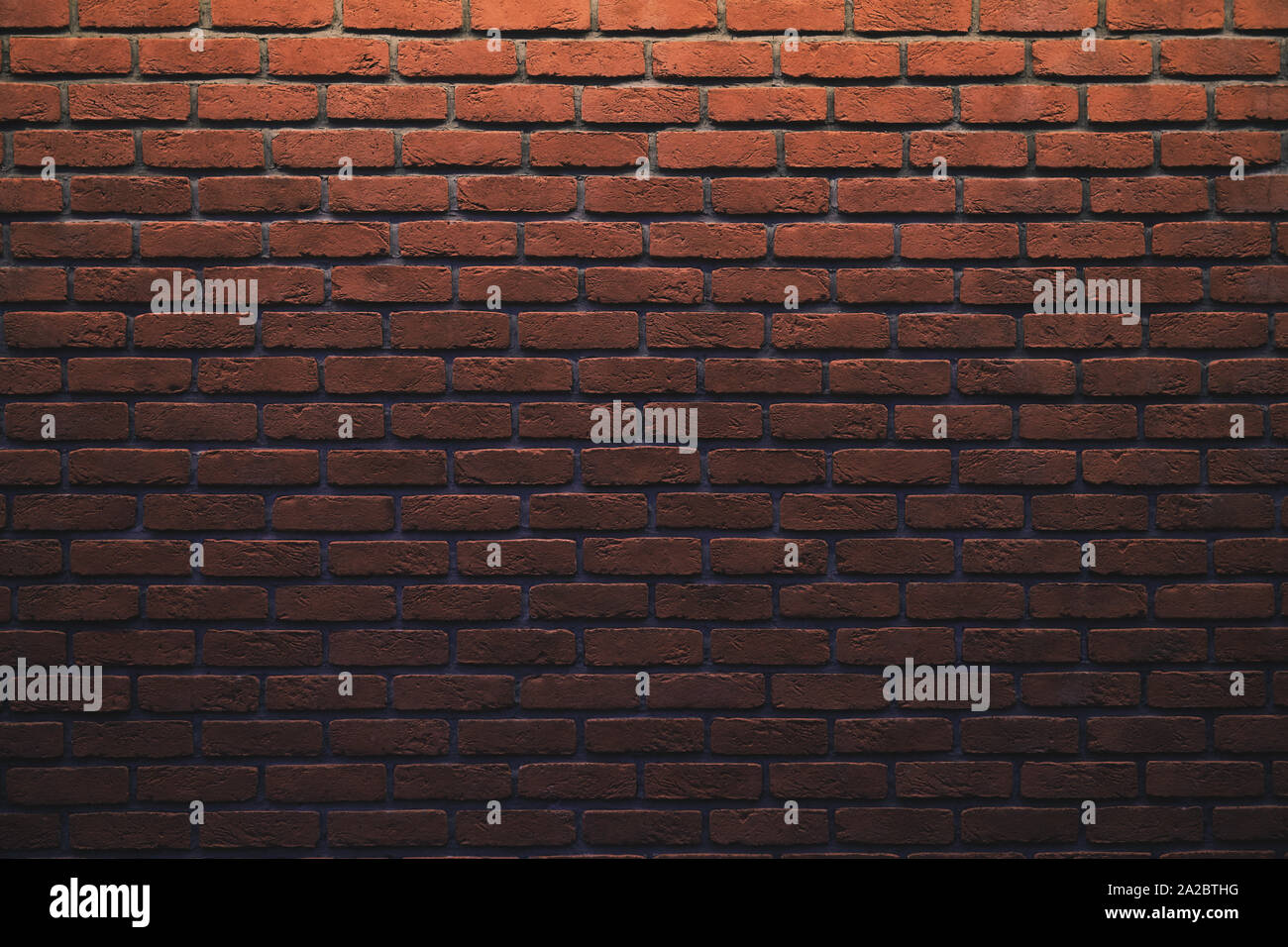 An orange brick wall with light gradient. Gradient stone background ...