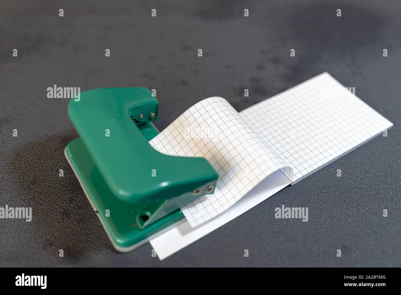 Note paper, hole punch and opposite organizer. Business and work ...