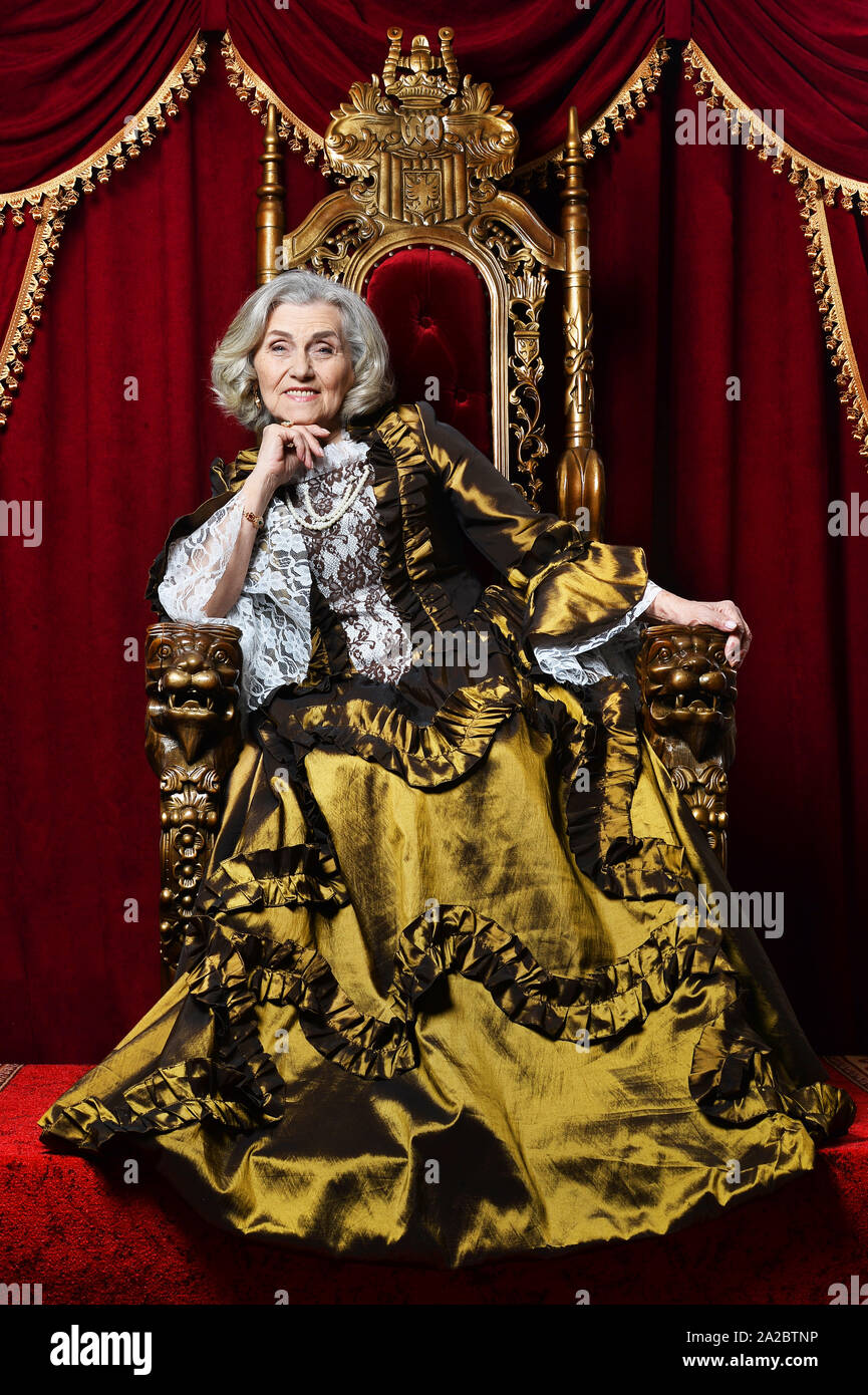 Portrait of beautiful senior queen on throne Stock Photo - Alamy