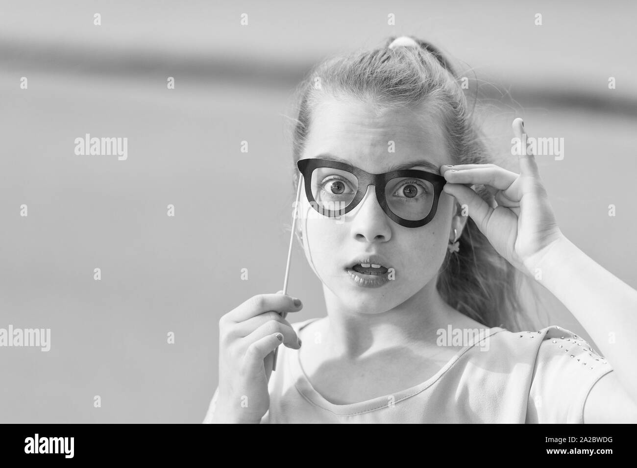 Nice day to have fun with photo booth props. Girl carefree child having ...