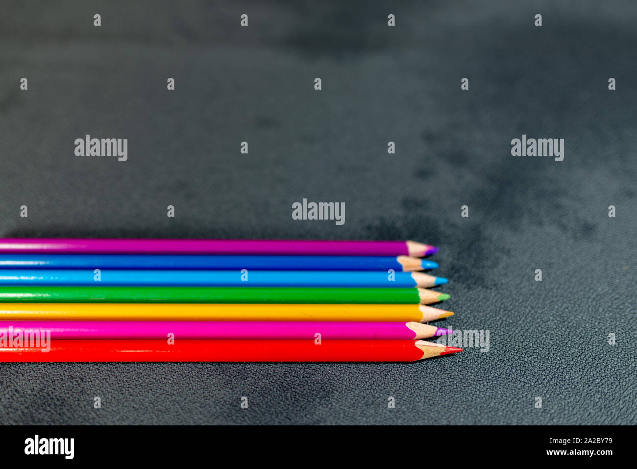 Colour pencils isolated on grey background close up.Flag of the Italian ...