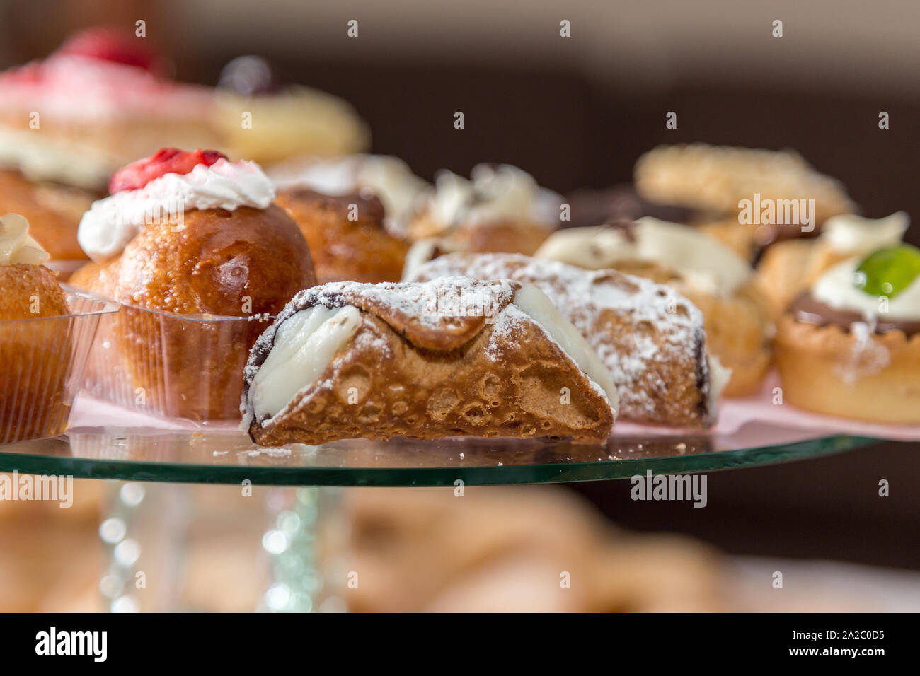 A piece of Sicilian dessert cannolo, typical pastry, Sicily, Italy ...