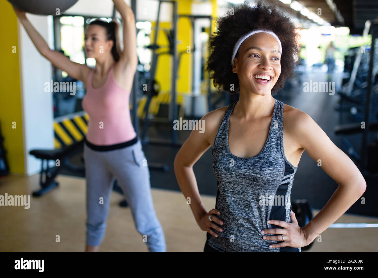Beautiful women working out in gym together Stock Photo - Alamy
