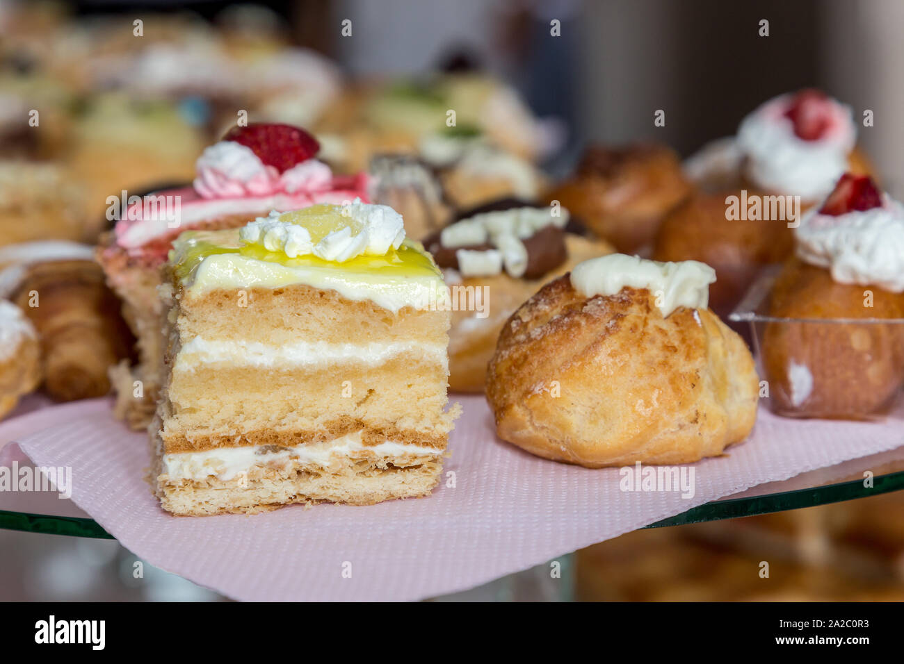 Typical Neapolitan pastry, with yellow cream and strawberry. Naples ...