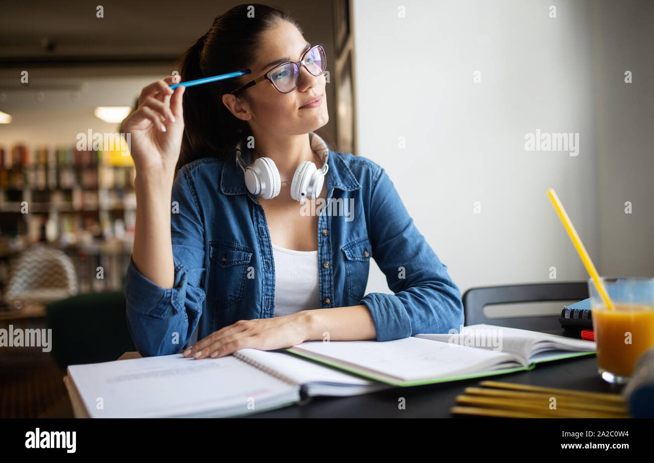 Beautiful student woman studying and learning at college Stock Photo ...