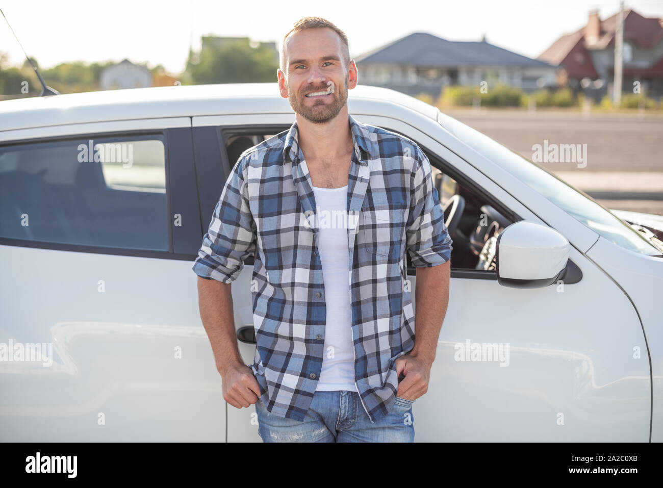 Young attractive man stands hi-res stock photography and images - Alamy