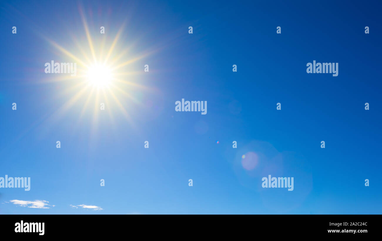 Sunny background, wonderful blue sky with bright sun Stock Photo - Alamy