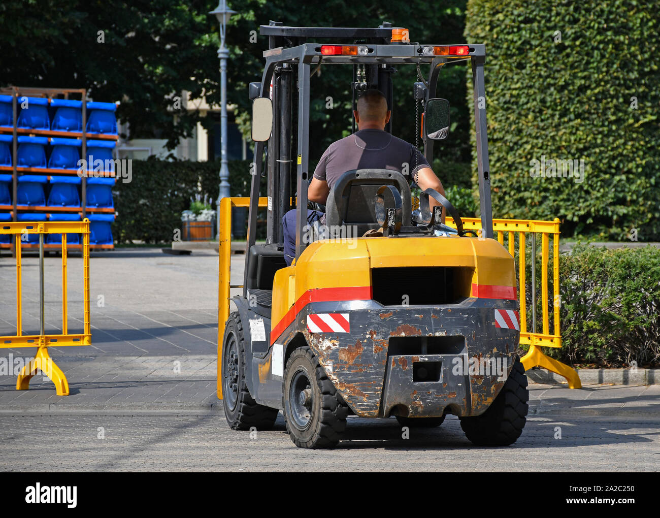 Man on forklift vehicle lifting hi-res stock photography and images - Alamy