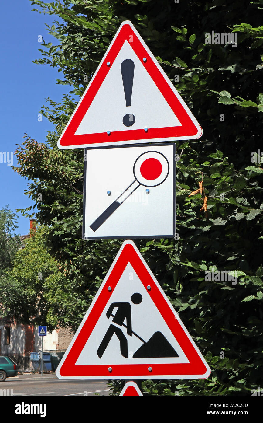 Road works and other traffic signs next to the road Stock Photo - Alamy