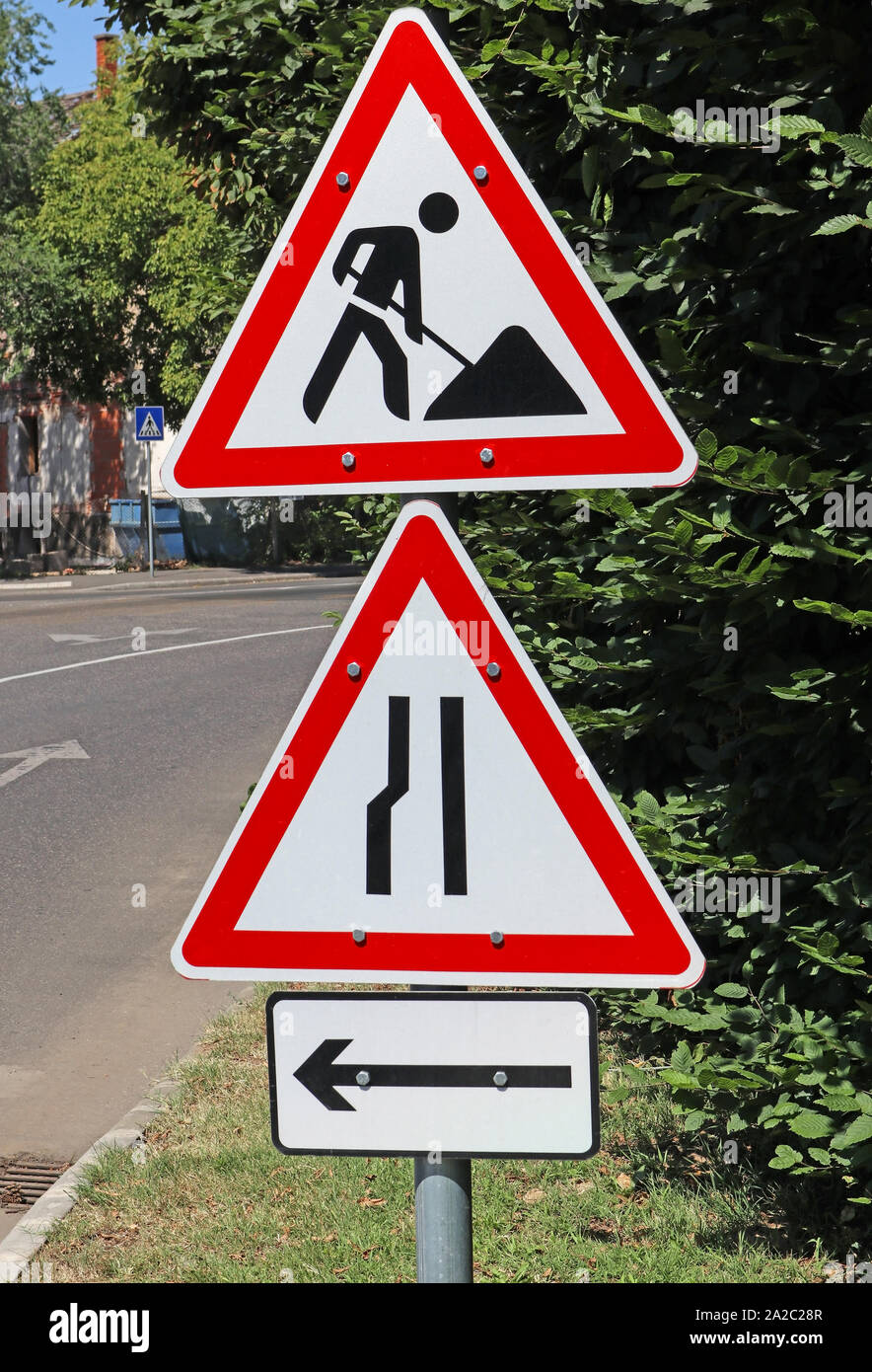 Road works and other traffic signs next to the road Stock Photo - Alamy