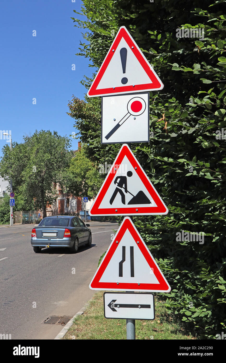 Road works and other traffic signs next to the road Stock Photo - Alamy