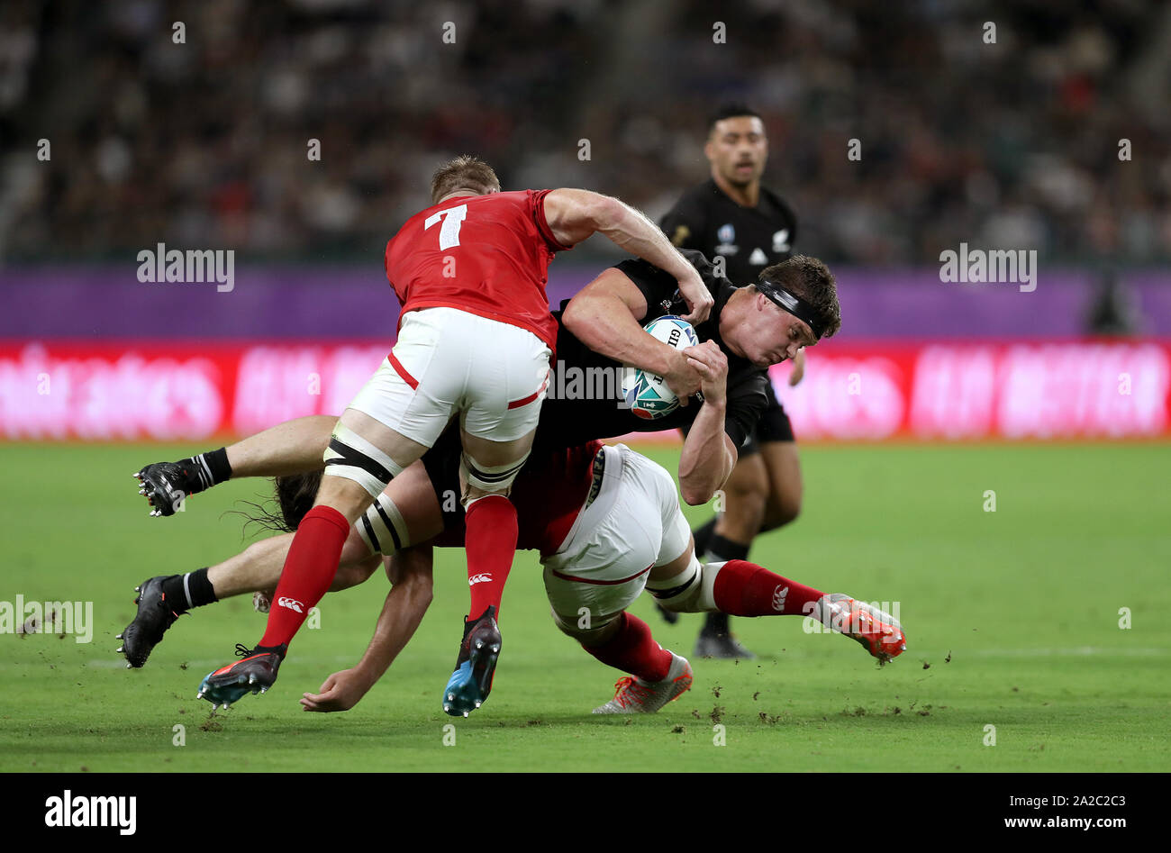 New Zealand's Scott Barrett is tackled by Canada's Matt Heaton (left ...