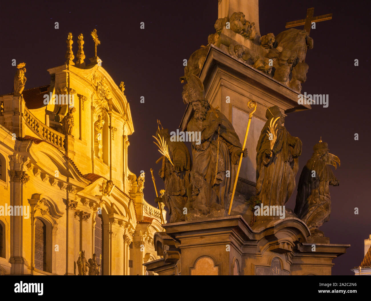 Prague - The baroque column of Holy Trinity and tower and facade of St ...