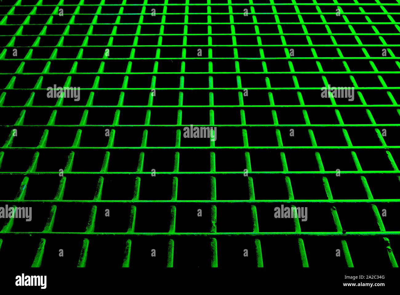 Slanted view on a green grid that can be used as background or ...