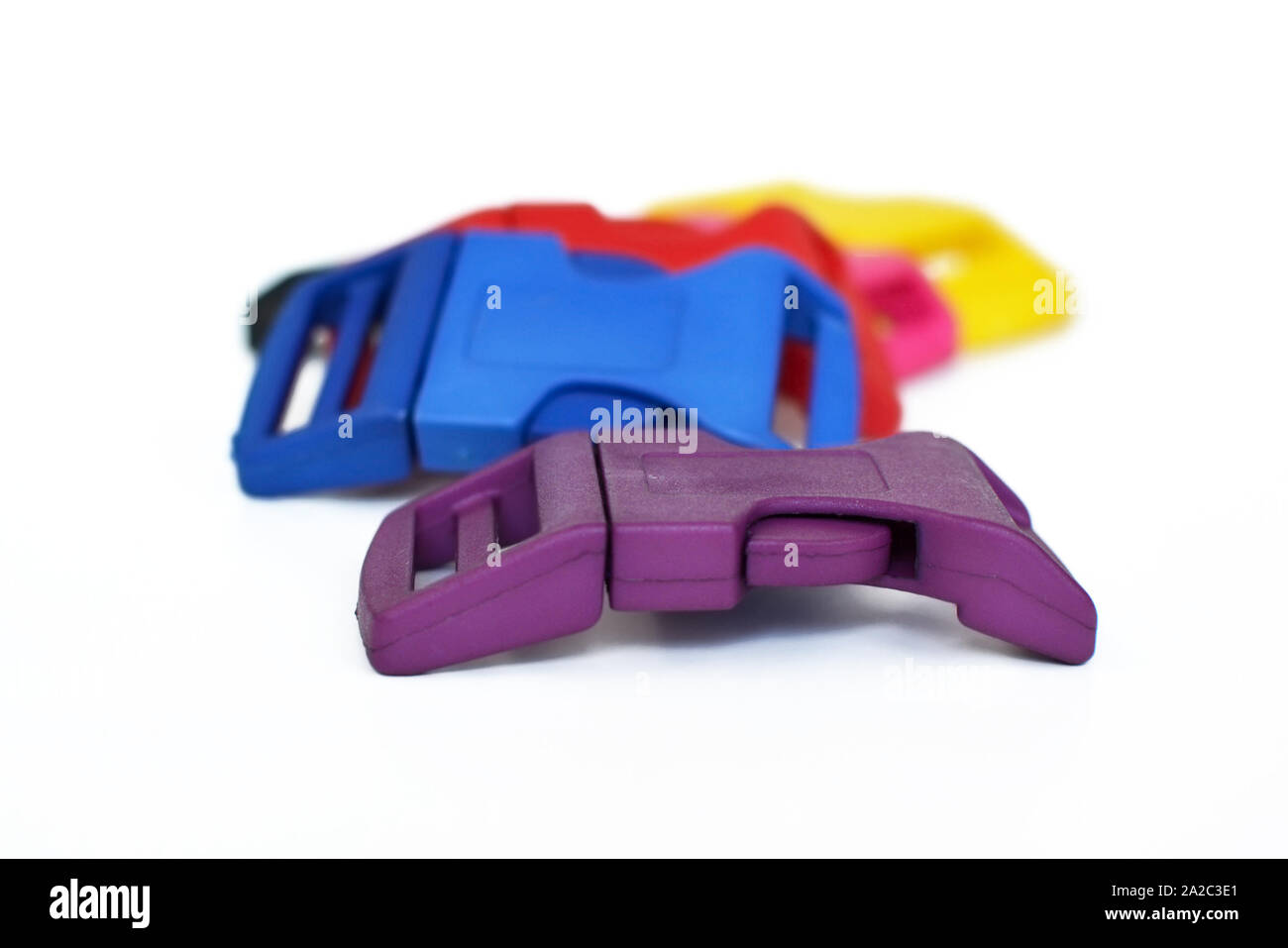 Multiple colorful closed quick side release plastic buckles isolated on ...