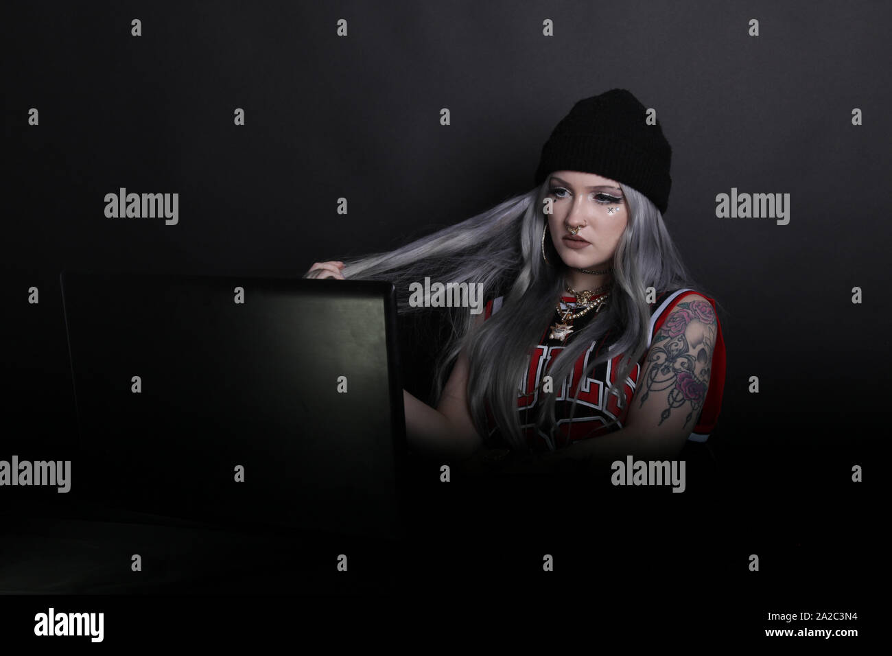 Female computer hacker sitting laptop hi-res stock photography and ...