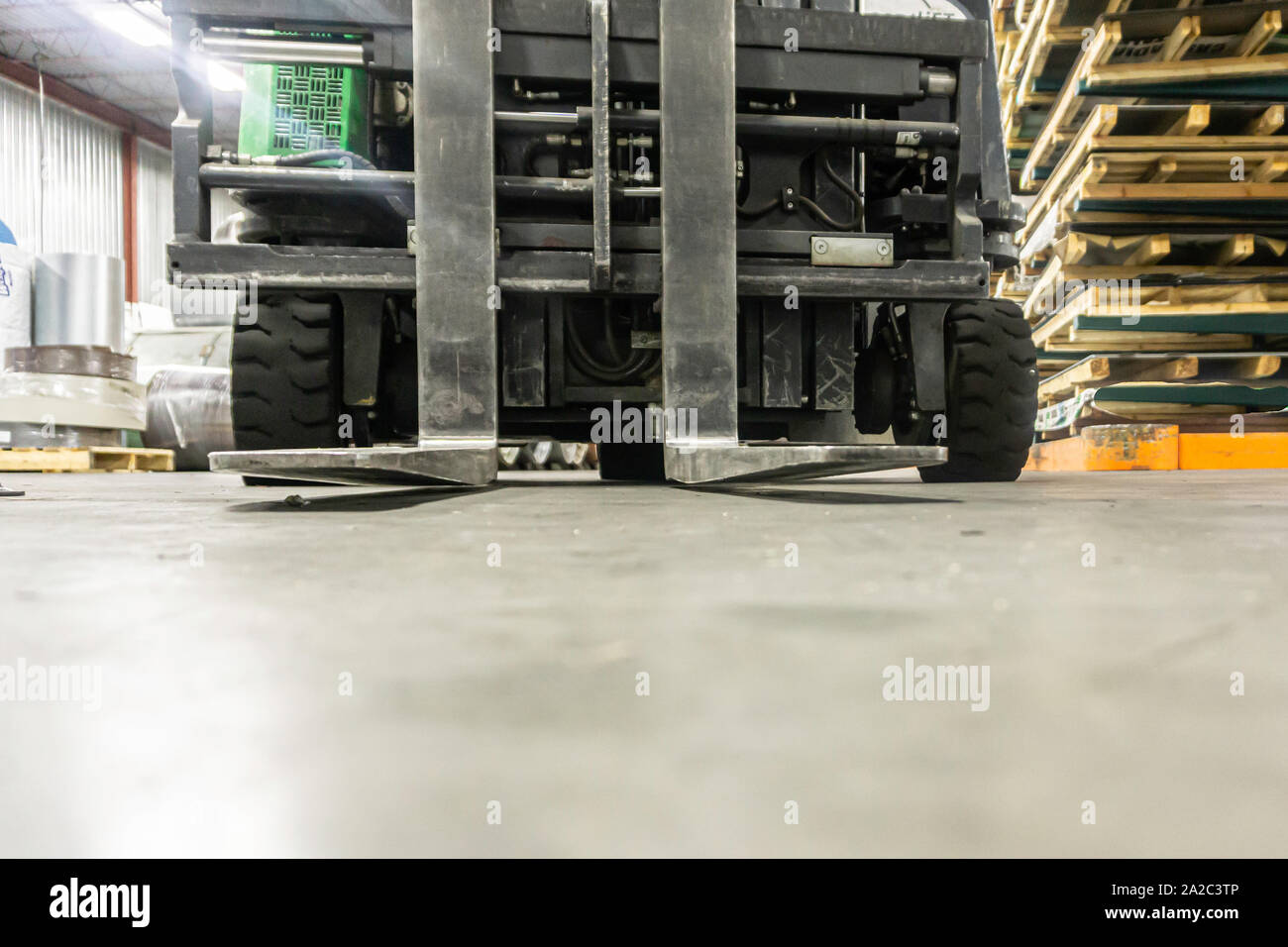 Forklift on factory workshop used for moving materials around Stock ...
