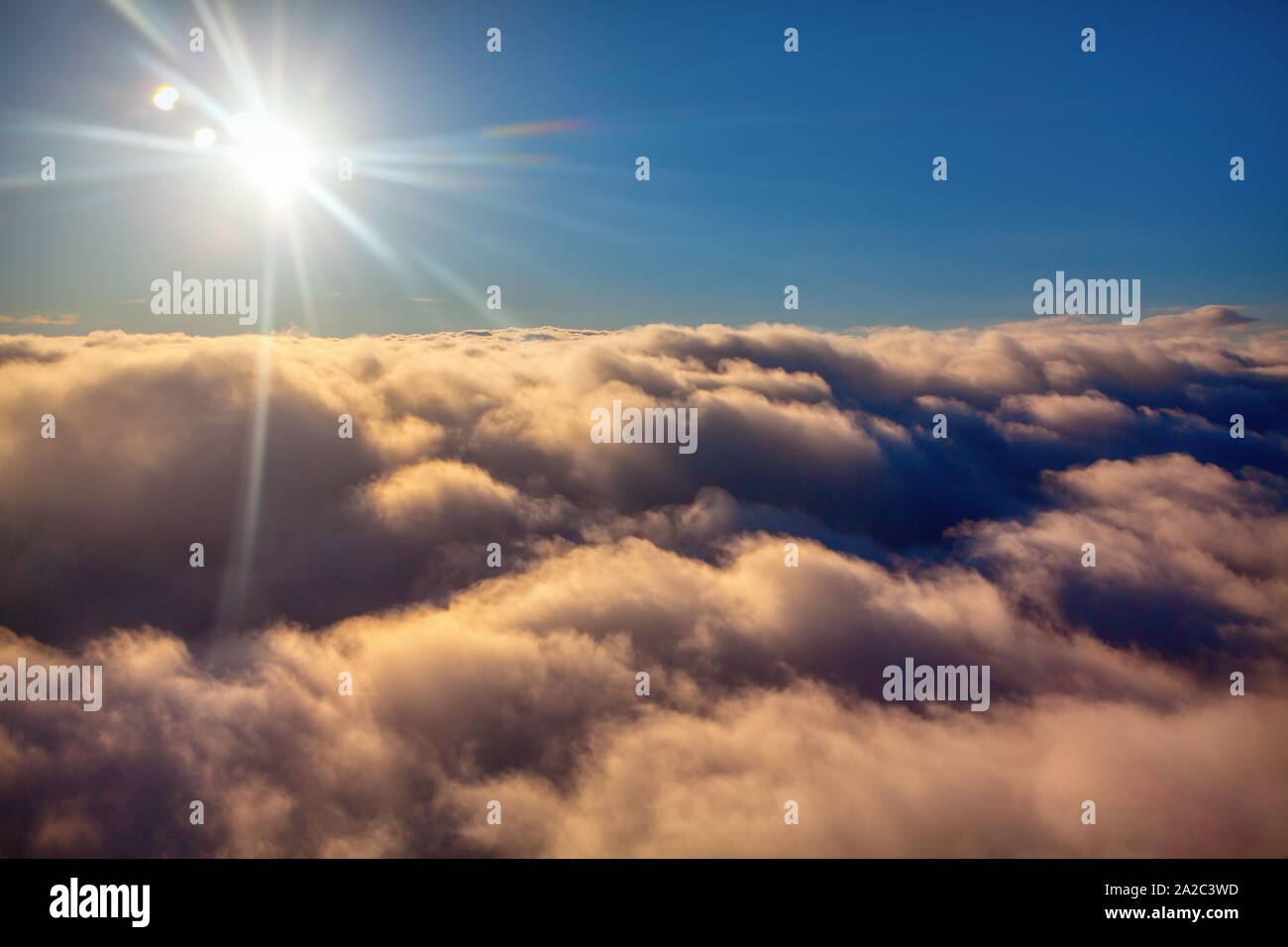 bright sun shining above the clouds Stock Photo - Alamy