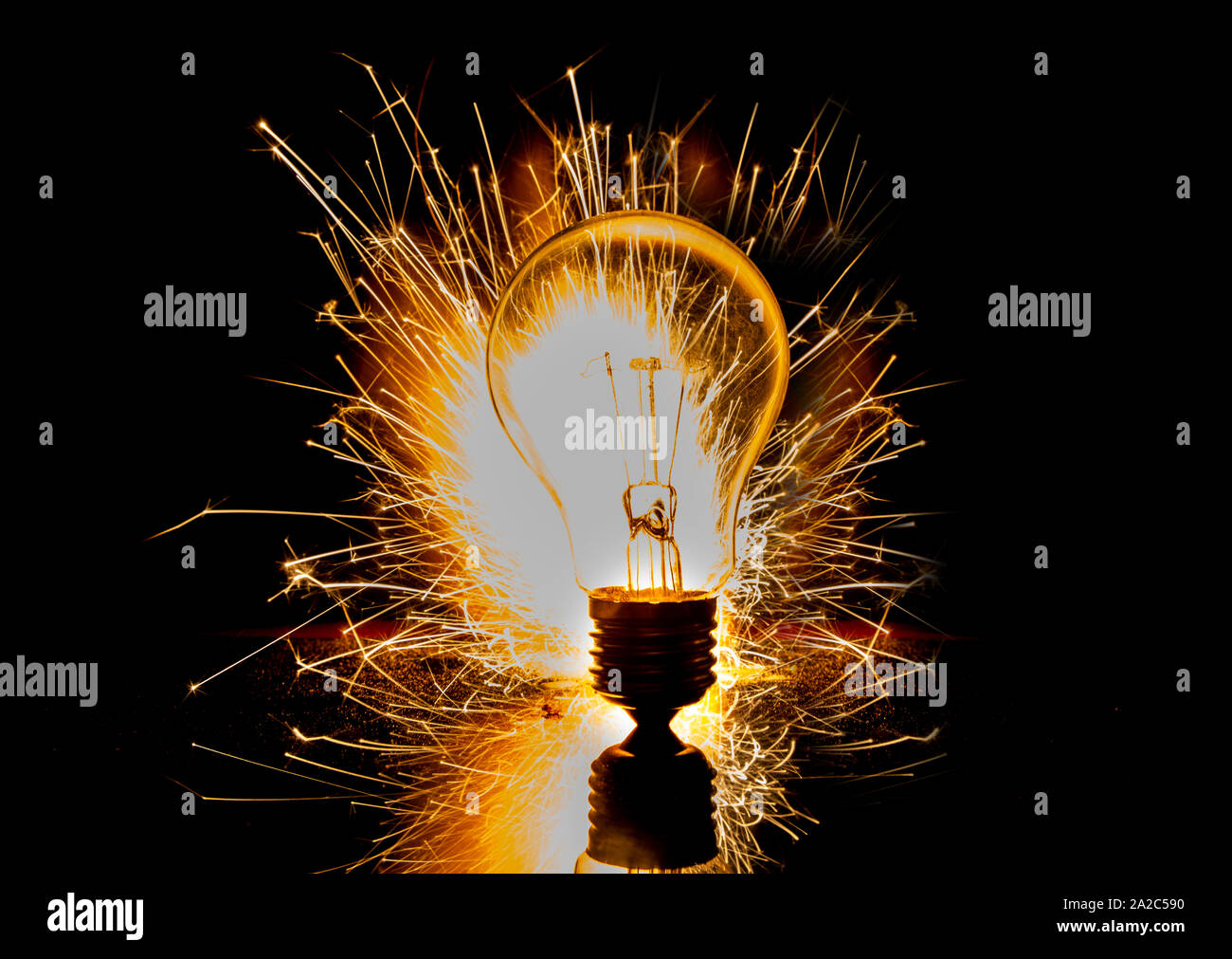 Electricity spark with bulb on black background with idea concept Stock ...