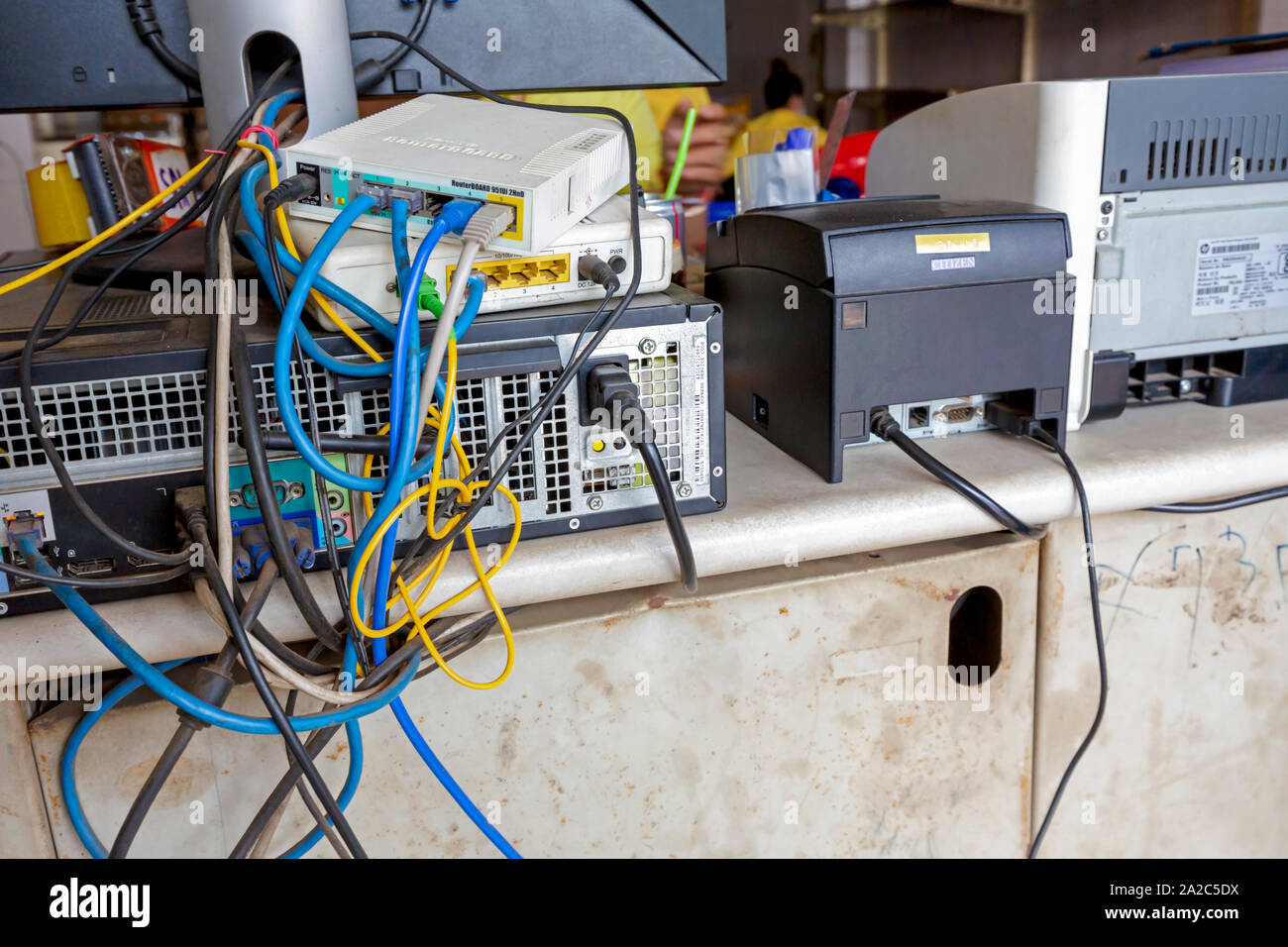 Office equipment rests on a desk that serves as a ticket counter inside ...