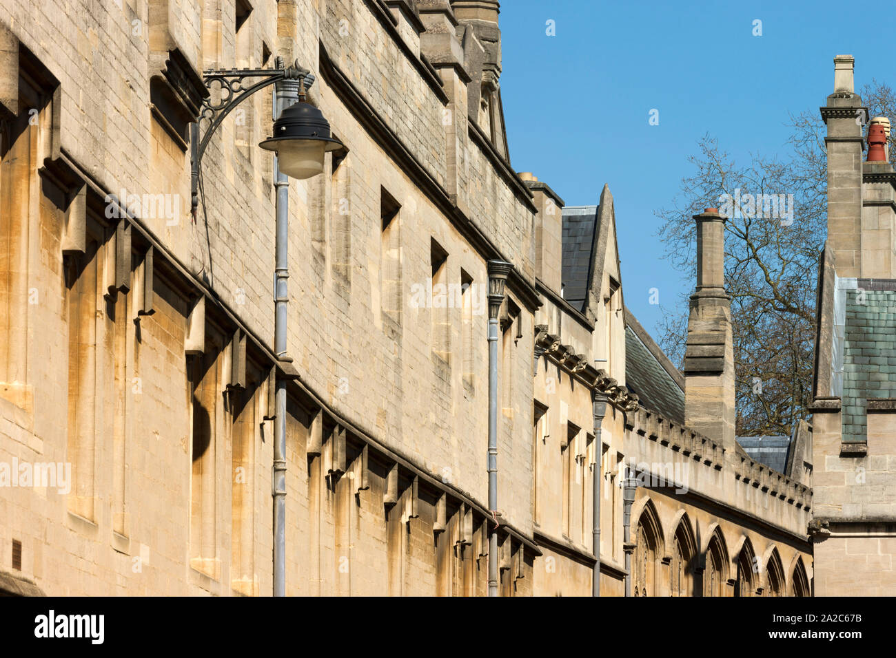 Curved street made from Cotswold stone with tall chimney stacks Stock ...