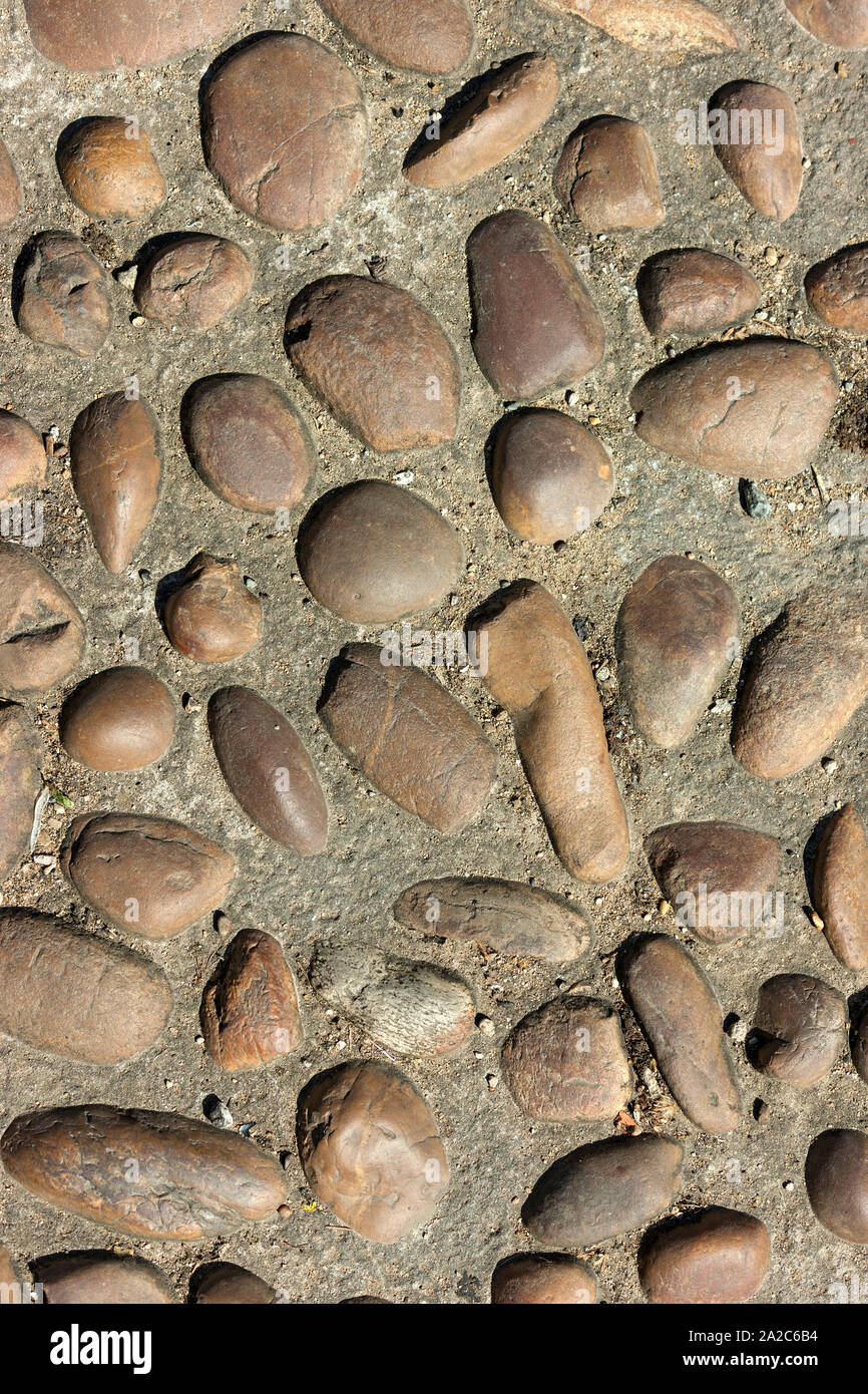 Pebble flooring creating a intricate pattern Stock Photo - Alamy