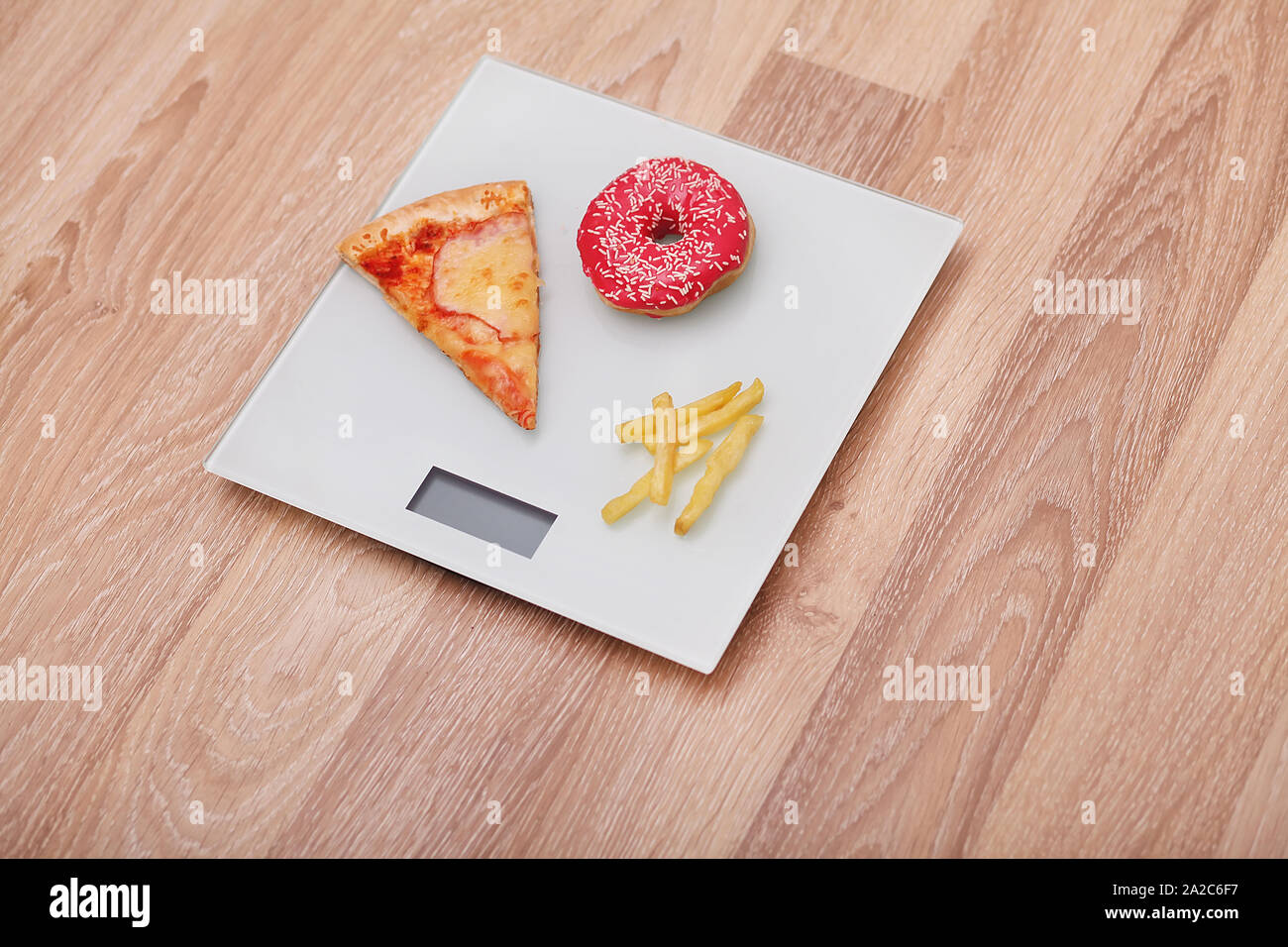Diet, Fast Food On Scale. Unhealthy Junk Food. Obesity Stock Photo - Alamy