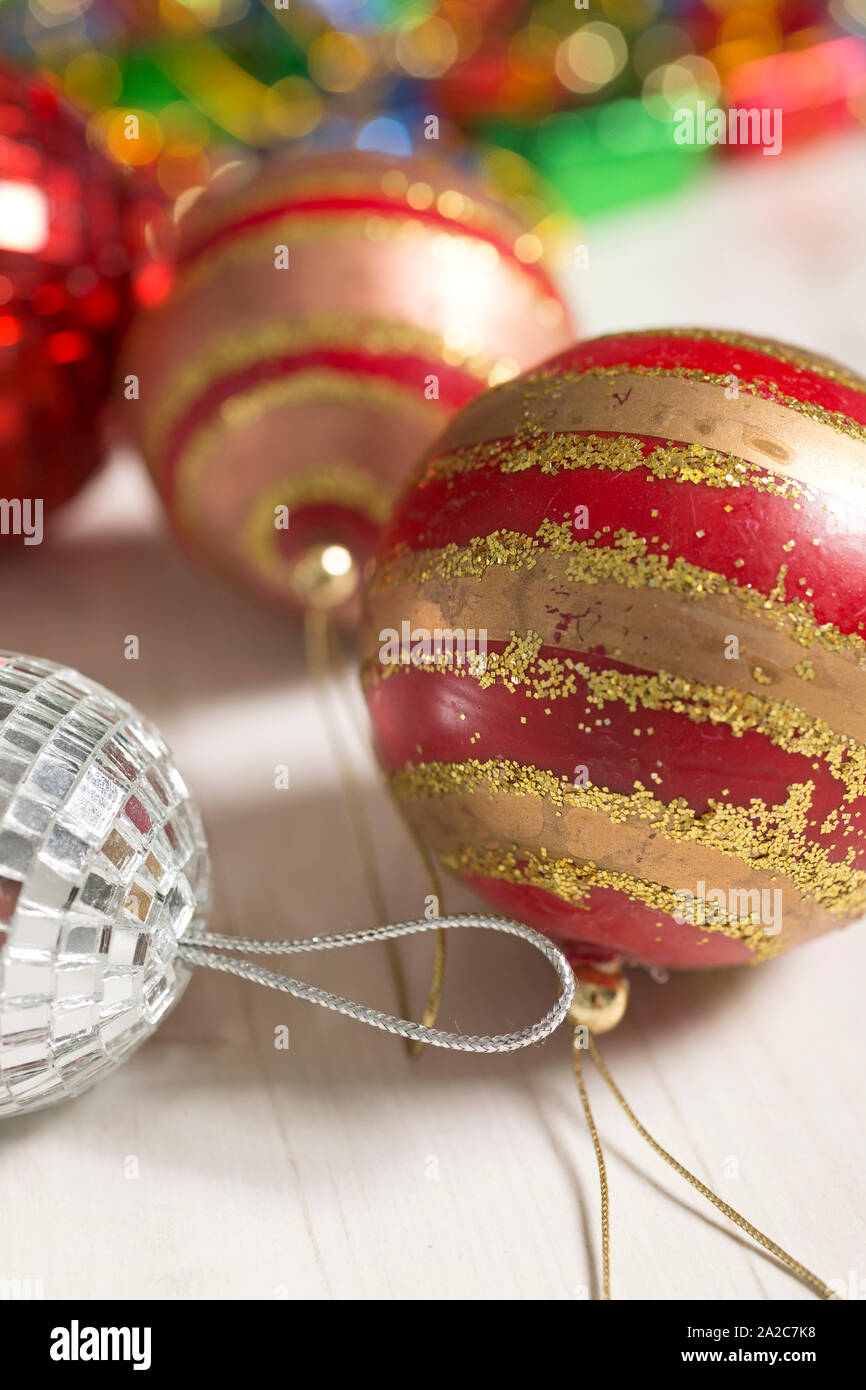 Selection of detailed Christmas bauble decorations on a light wooden ...