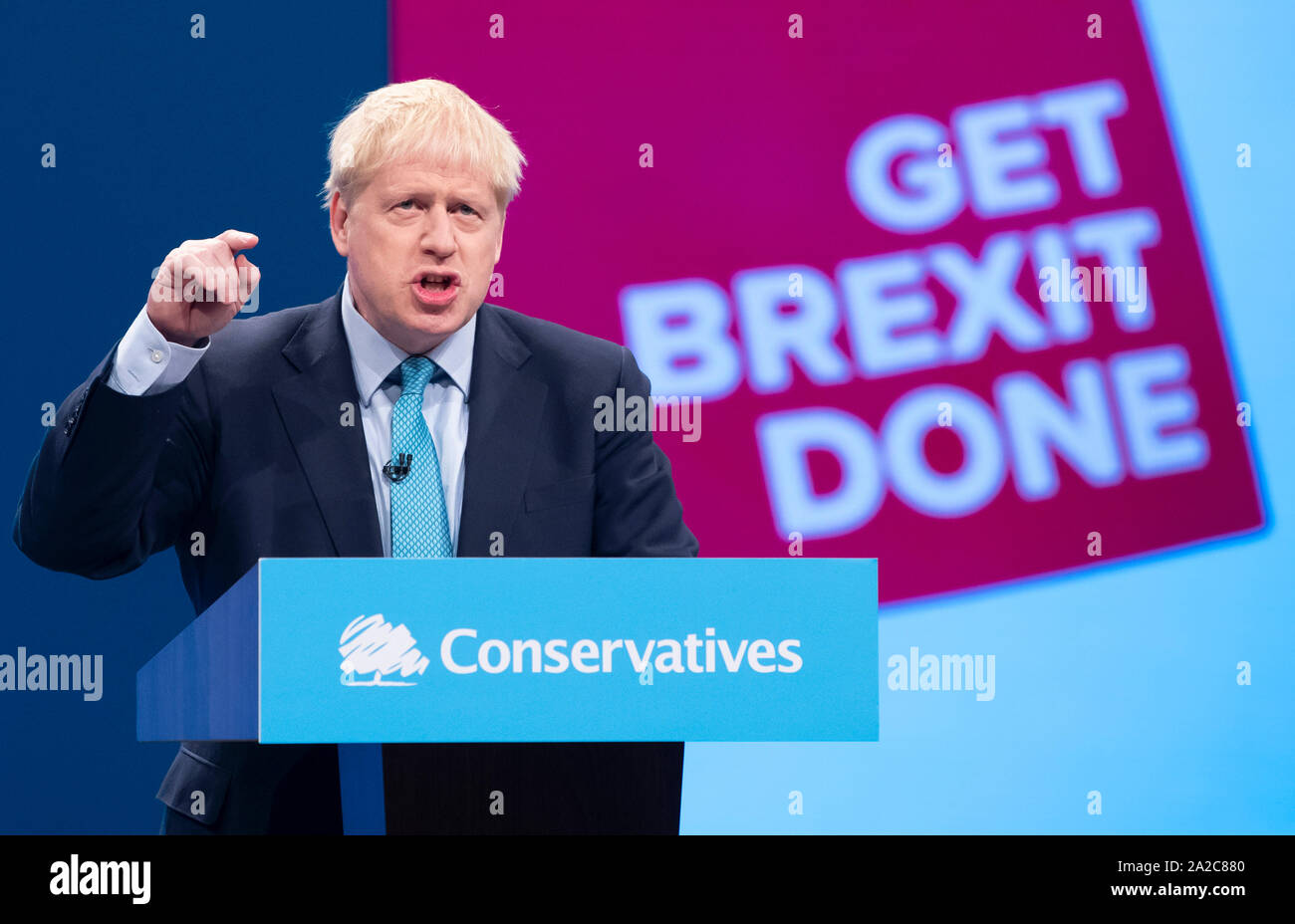 Prime Minister Boris Johnson on stage giving his speech at the ...