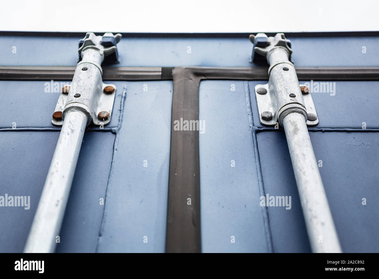 Blue metal door on a large shipping container Stock Photo - Alamy